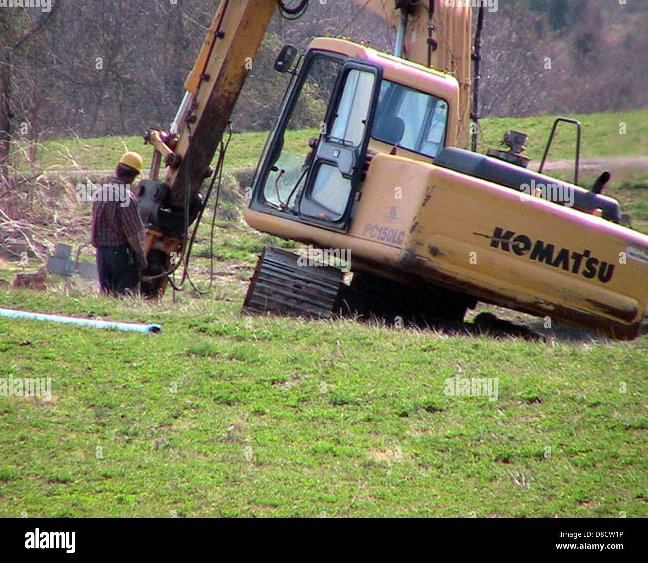 A loader excavator in operation, moving large amounts of dirt and ...
