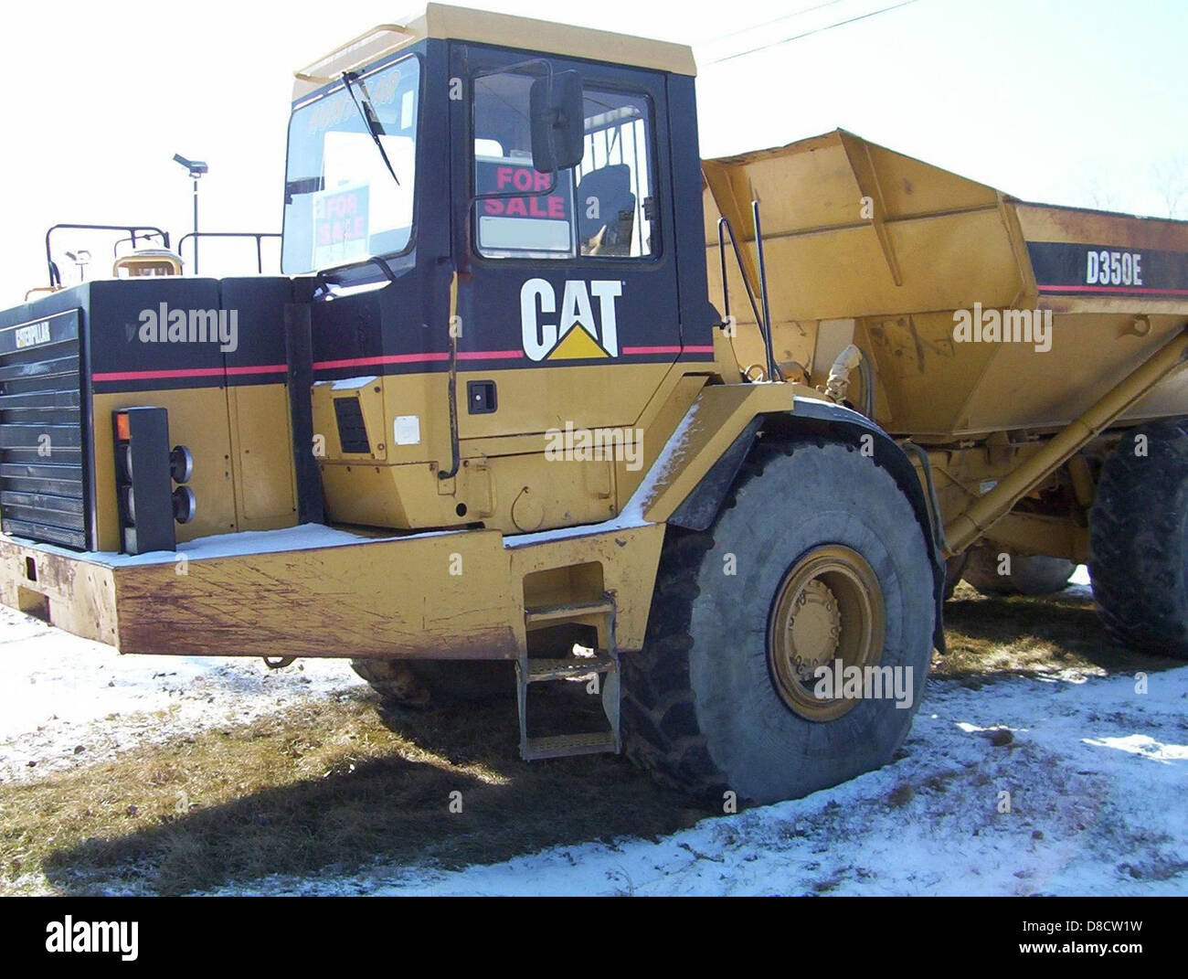 A front view of a loader truck is shown, a heavy-duty vehicle designed ...