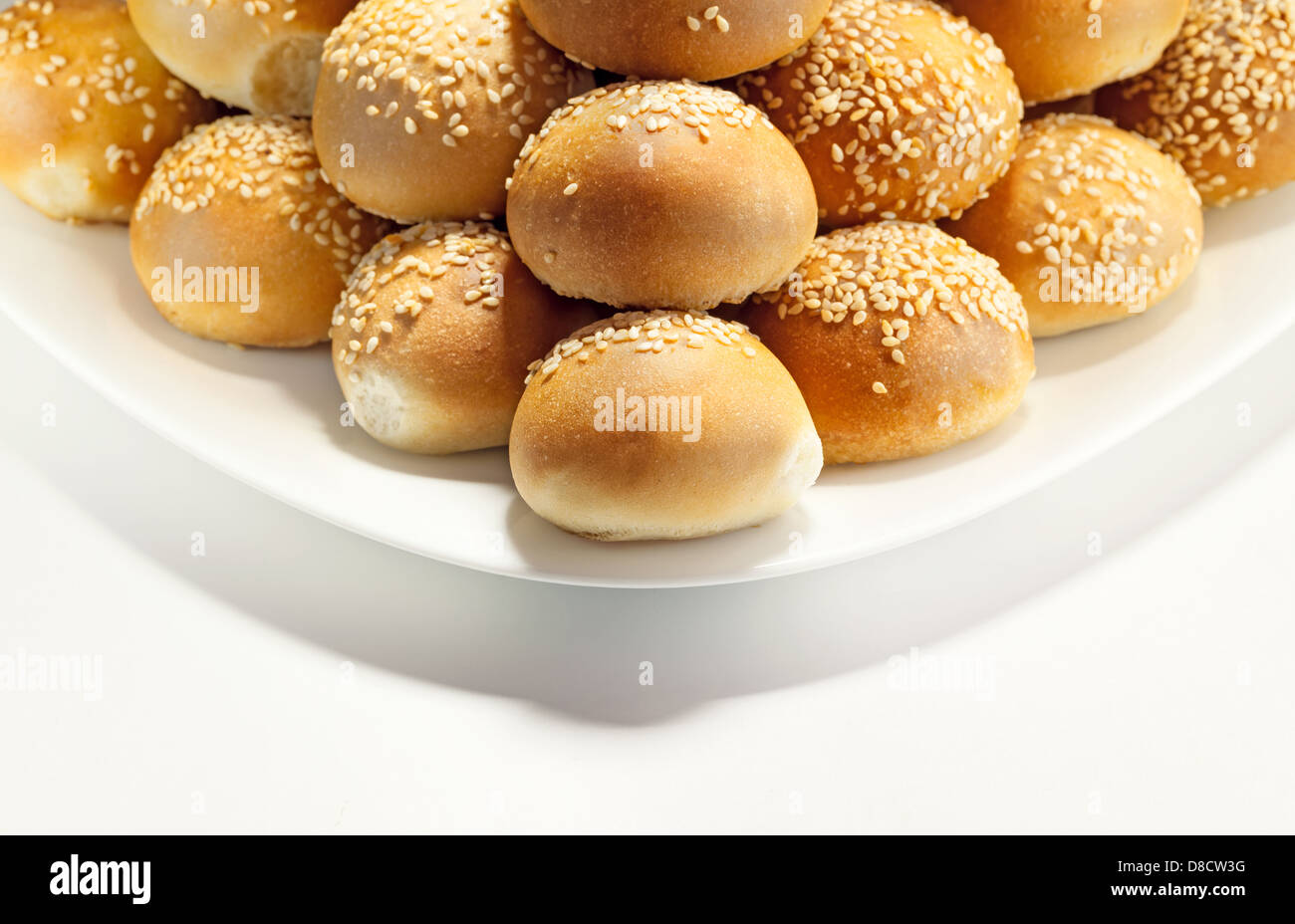 Little buns on plate, studio isolated Stock Photo - Alamy