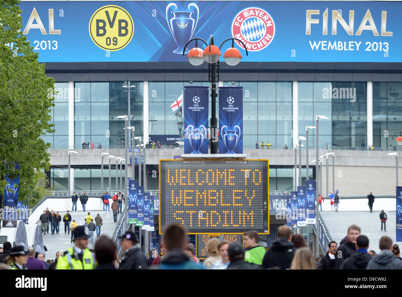 A sign welcomes visitors in front of the Wembley stadium in London ...