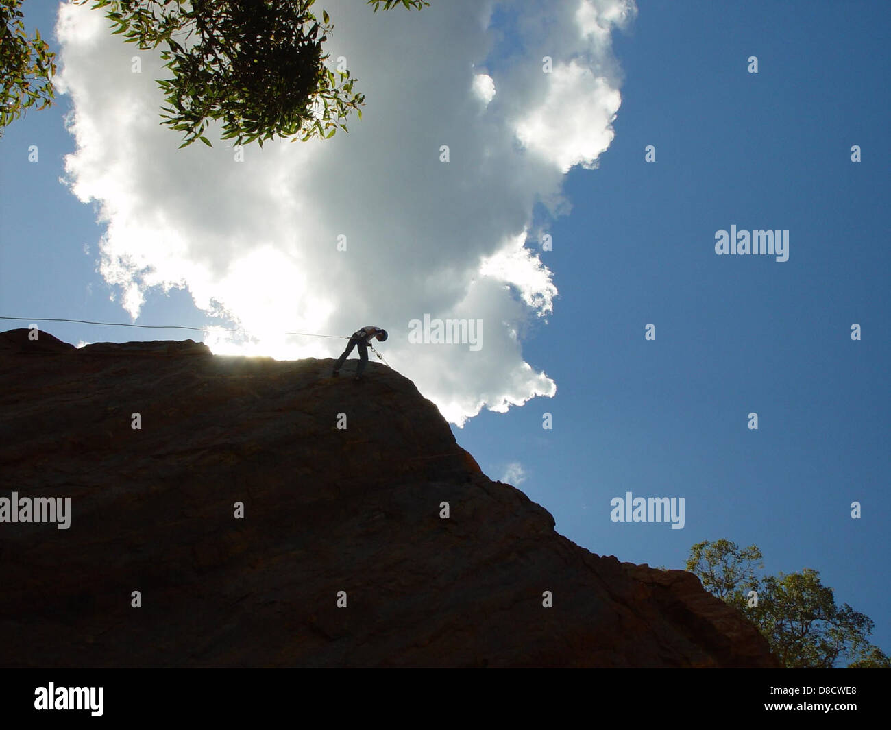 A man is climbing a mountain, focusing on the physical challenge and ...