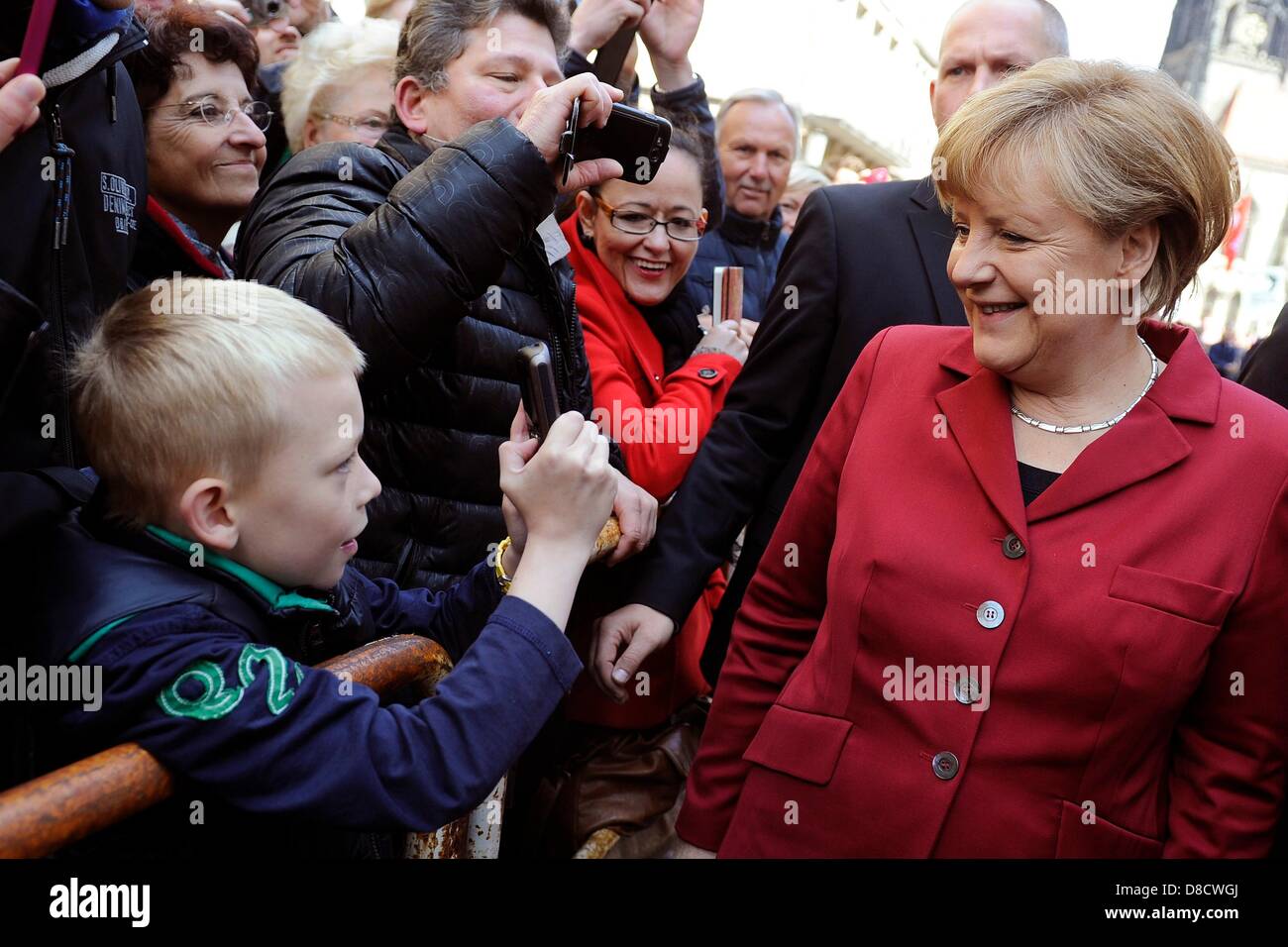 German chancellor Angela Merkel (CDU) greets passerby during her visit ...