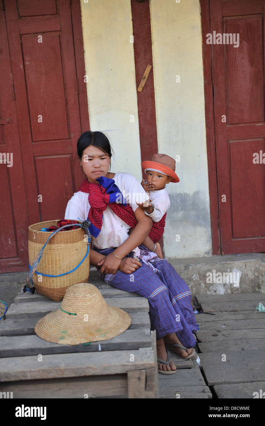 mom and little boy taking a break from shopping at the Aungban market Stock Photo - Alamy