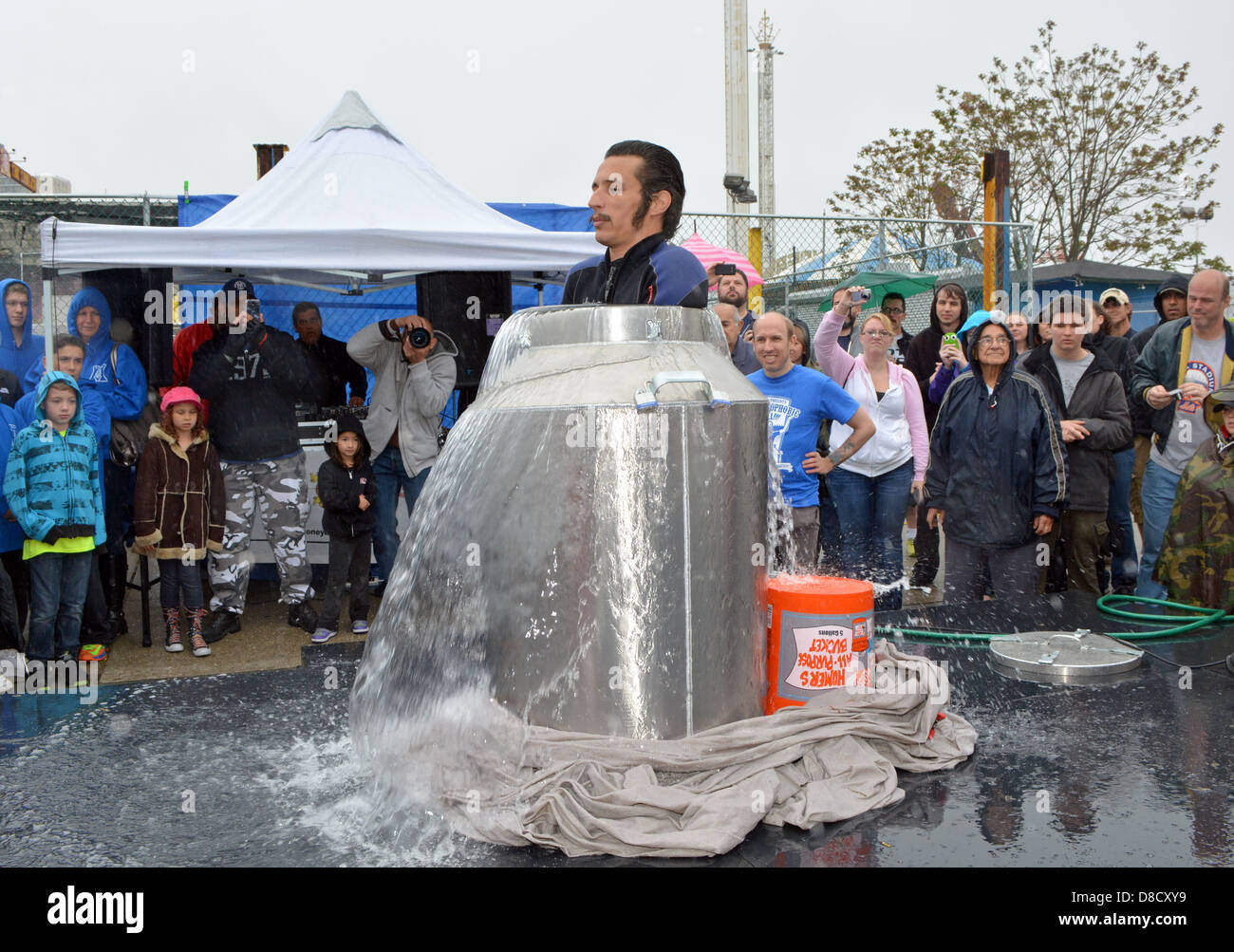 Adam Cardone doing the great milk can escape at the annual Coney Island ...