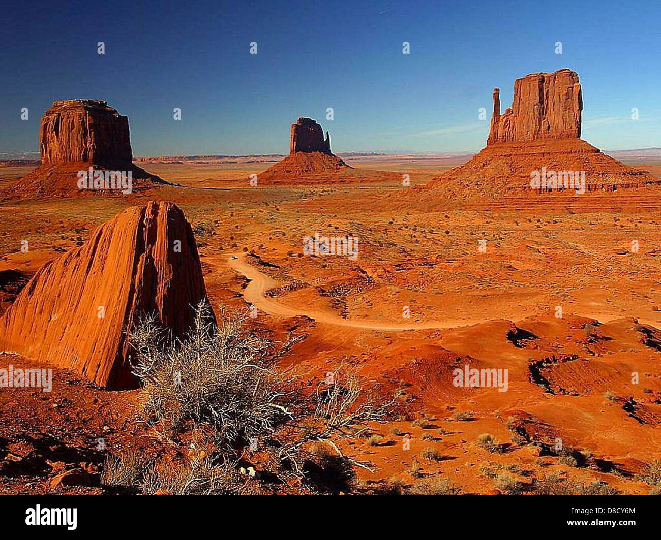 The iconic sandstone rock formations of Monument Valley rise ...