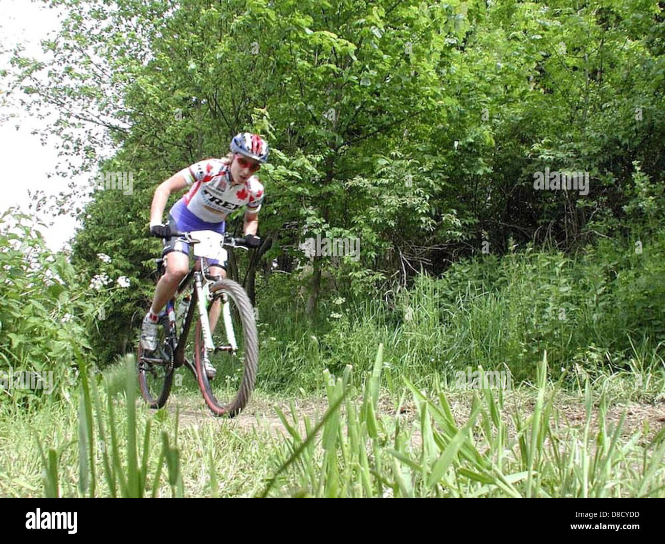 A motocross race in action, featuring riders navigating a dirt track ...