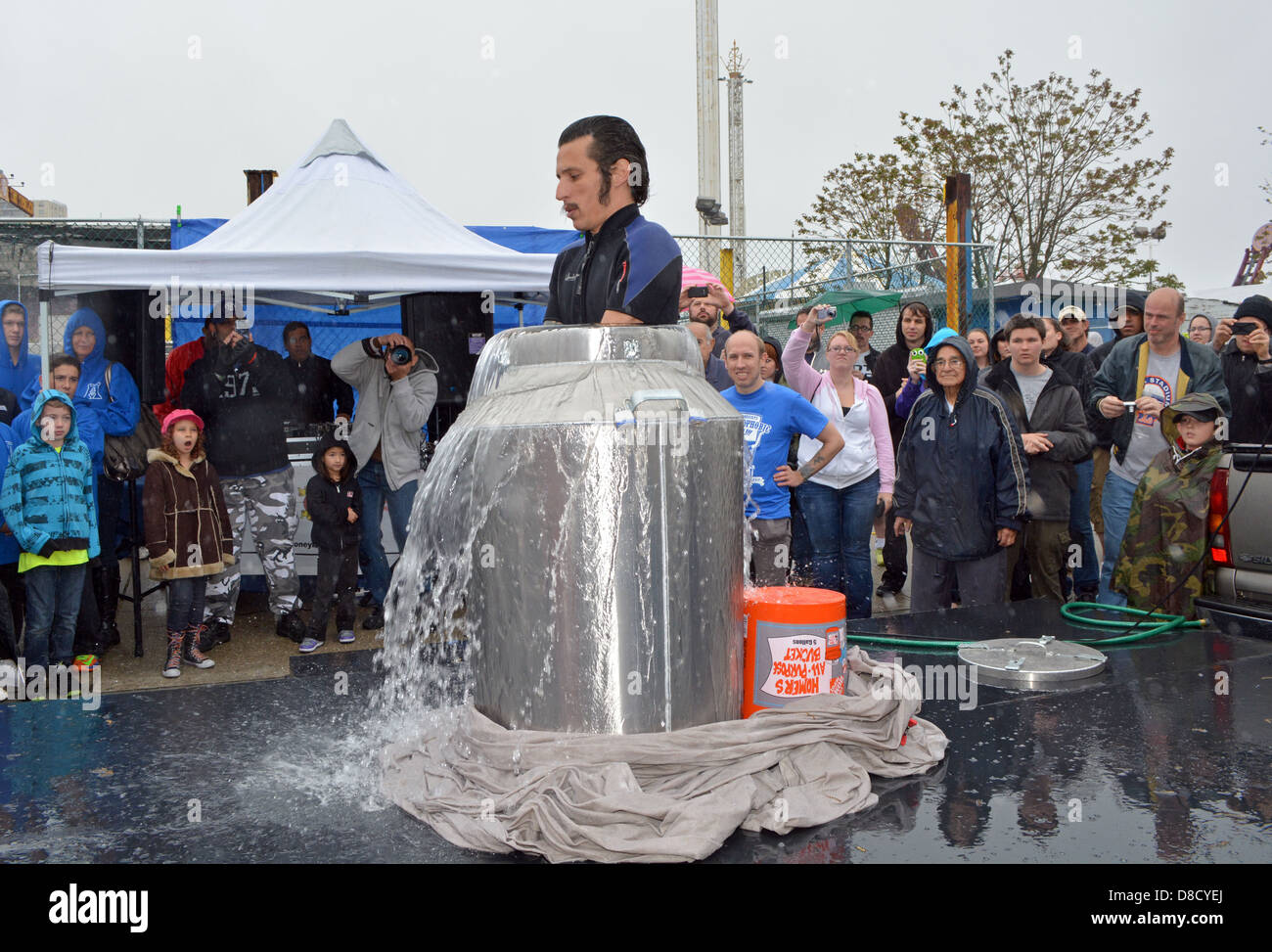 Adam Cardone doing the great milk can escape at the annual Coney Island ...