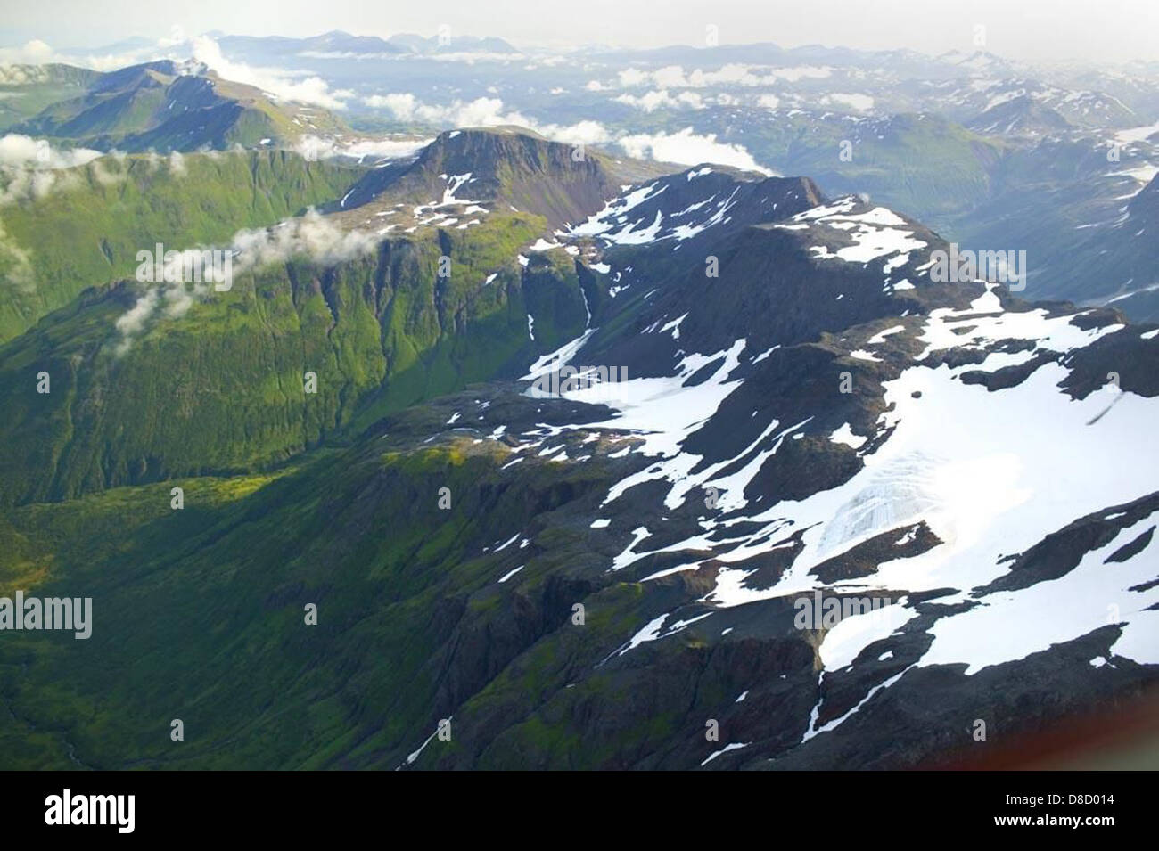 An aerial view of rugged mountain peaks, showcasing the natural ...