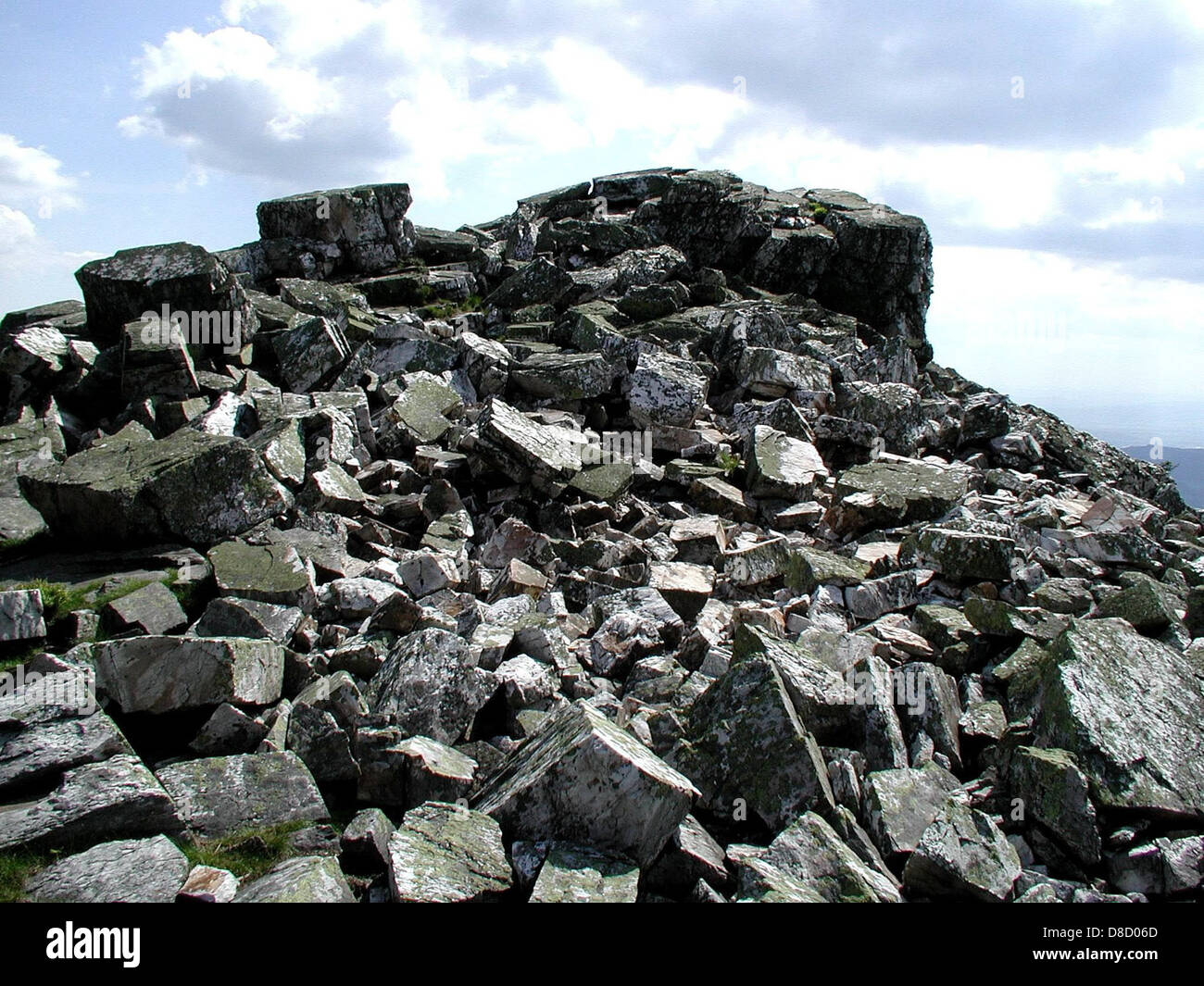 Mountain rocks display various geological formations, with rugged ...