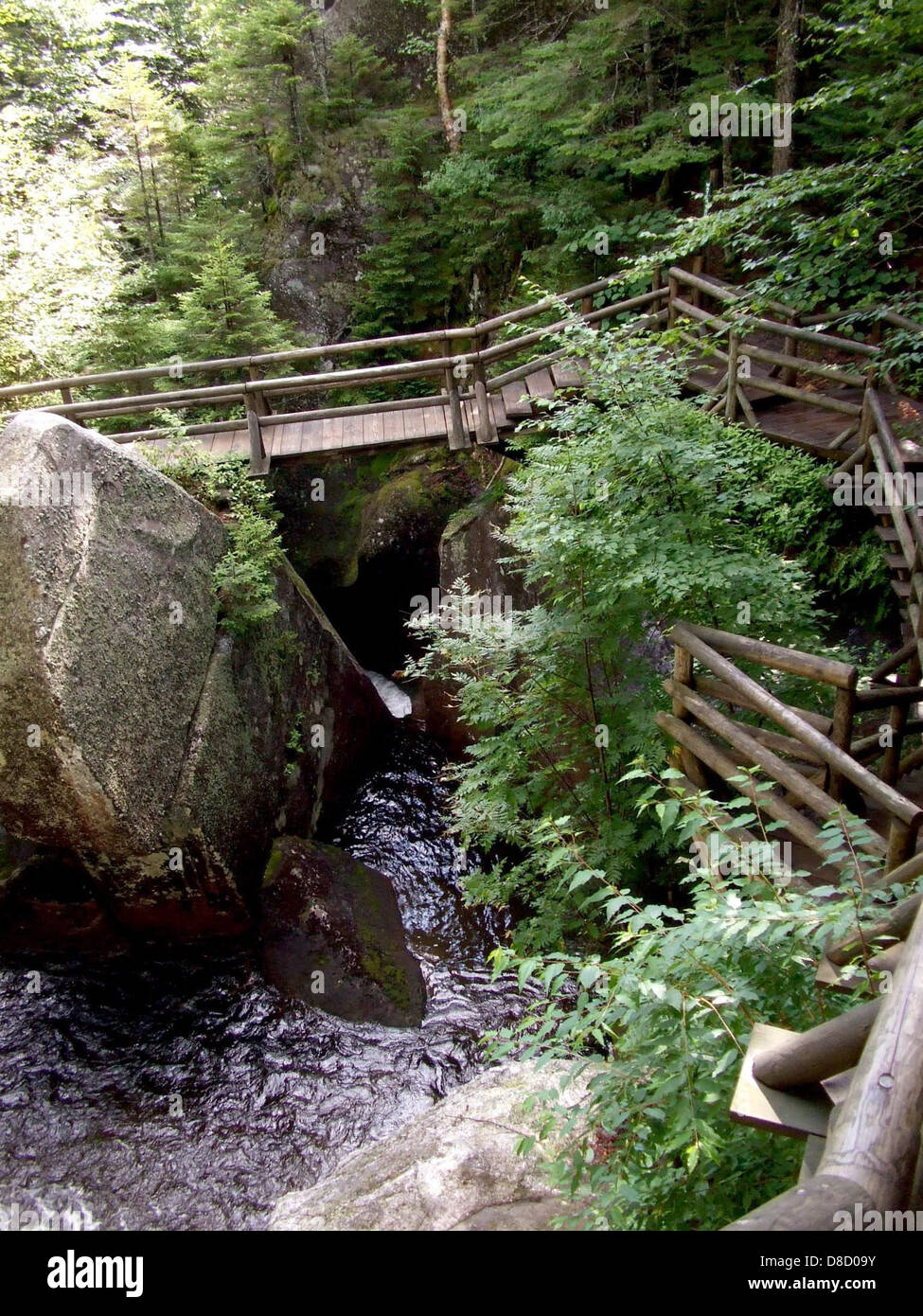 Mountain wooden bridge over the water Stock Photo - Alamy