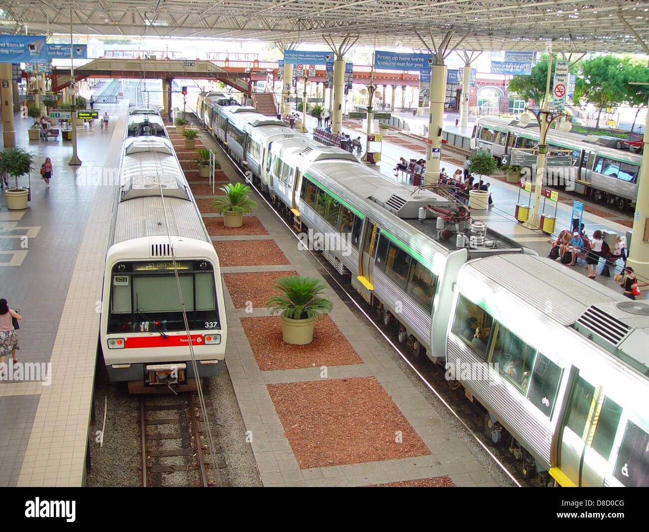 A full train pulling out of a station, with visible carriages and ...