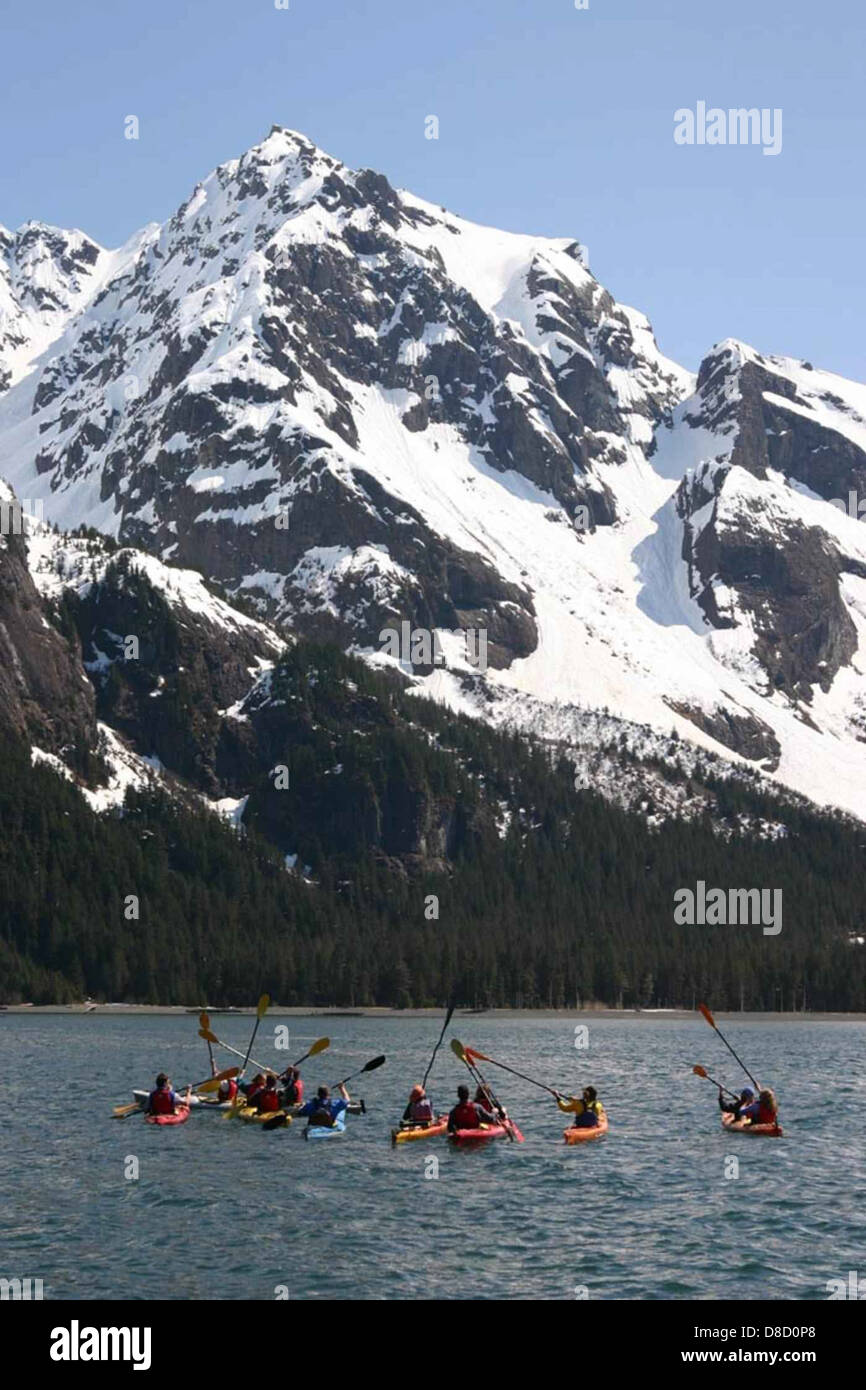 A group of people kayaking in Resurrection Bay, a scenic coastal area ...