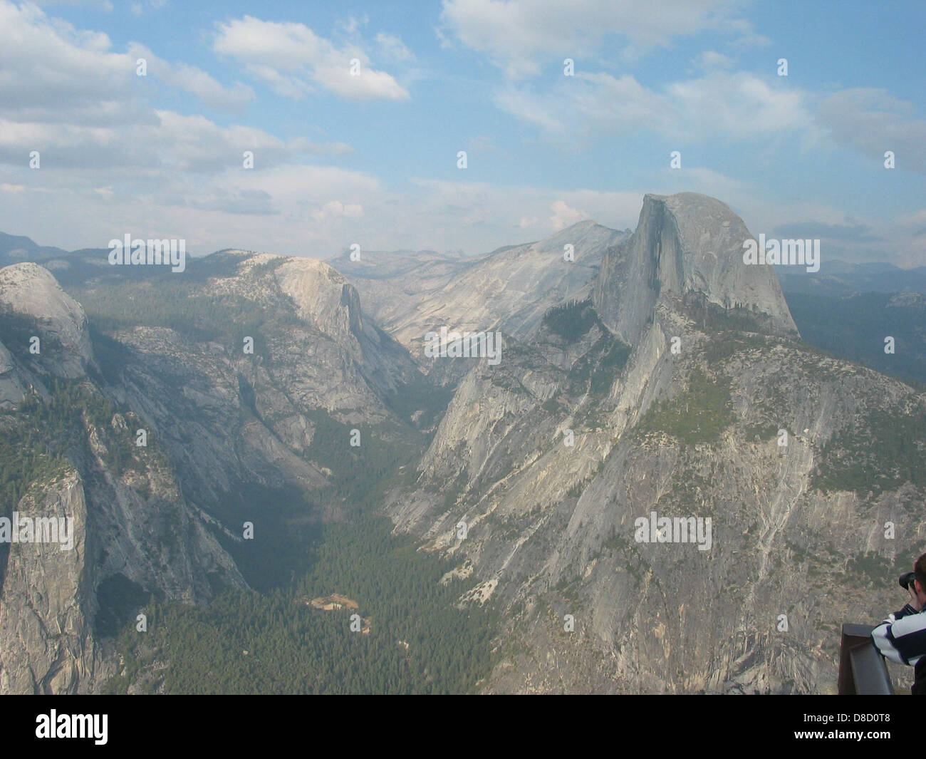This image captures the iconic Half Dome, a prominent granite peak in a ...