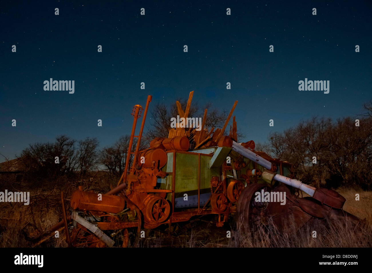 Abandoned old farm equipment Thrasher in a field out in West Texas ...