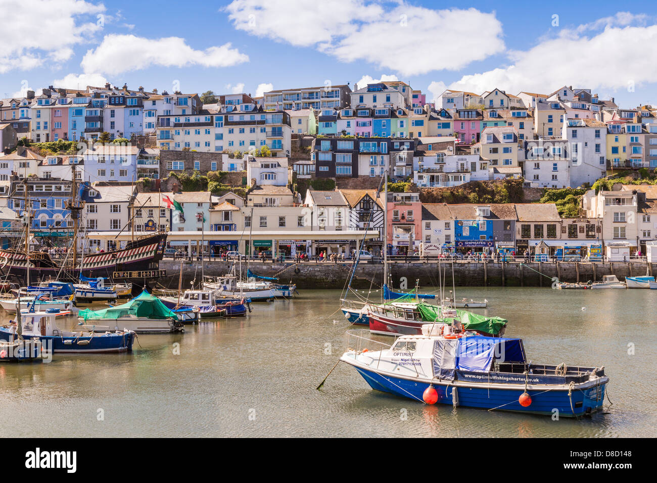 Brixham Harbour with colourful houses in the background Stock Photo - Alamy