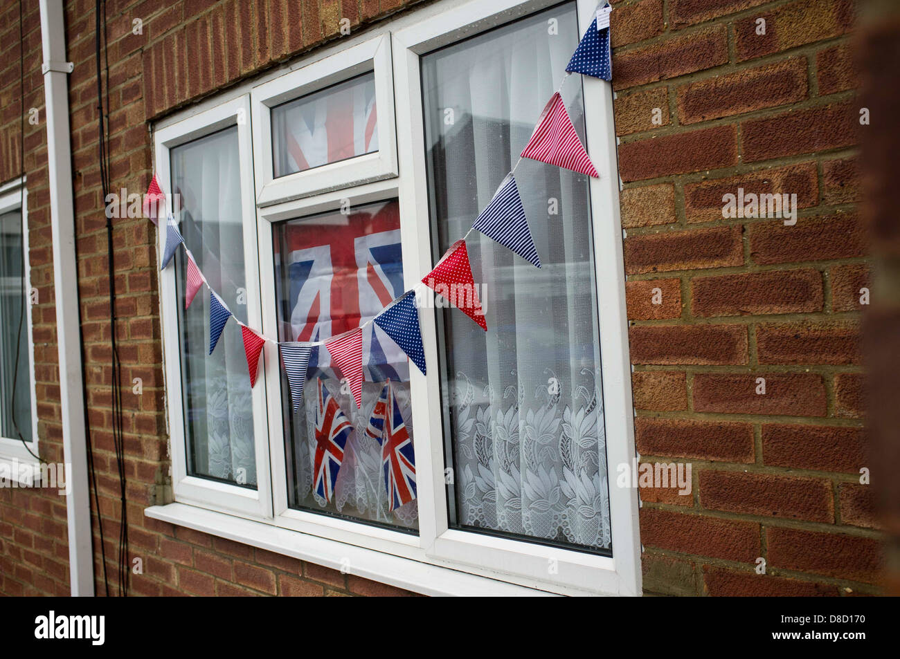 union jack street party flags and bunting in front window of house in ...