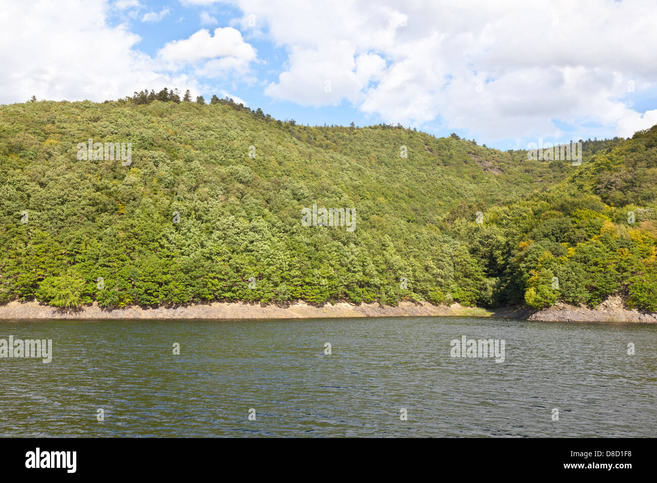 Lake Rursee cliff lakeshore with cloudy sky and sunlight in summer ...