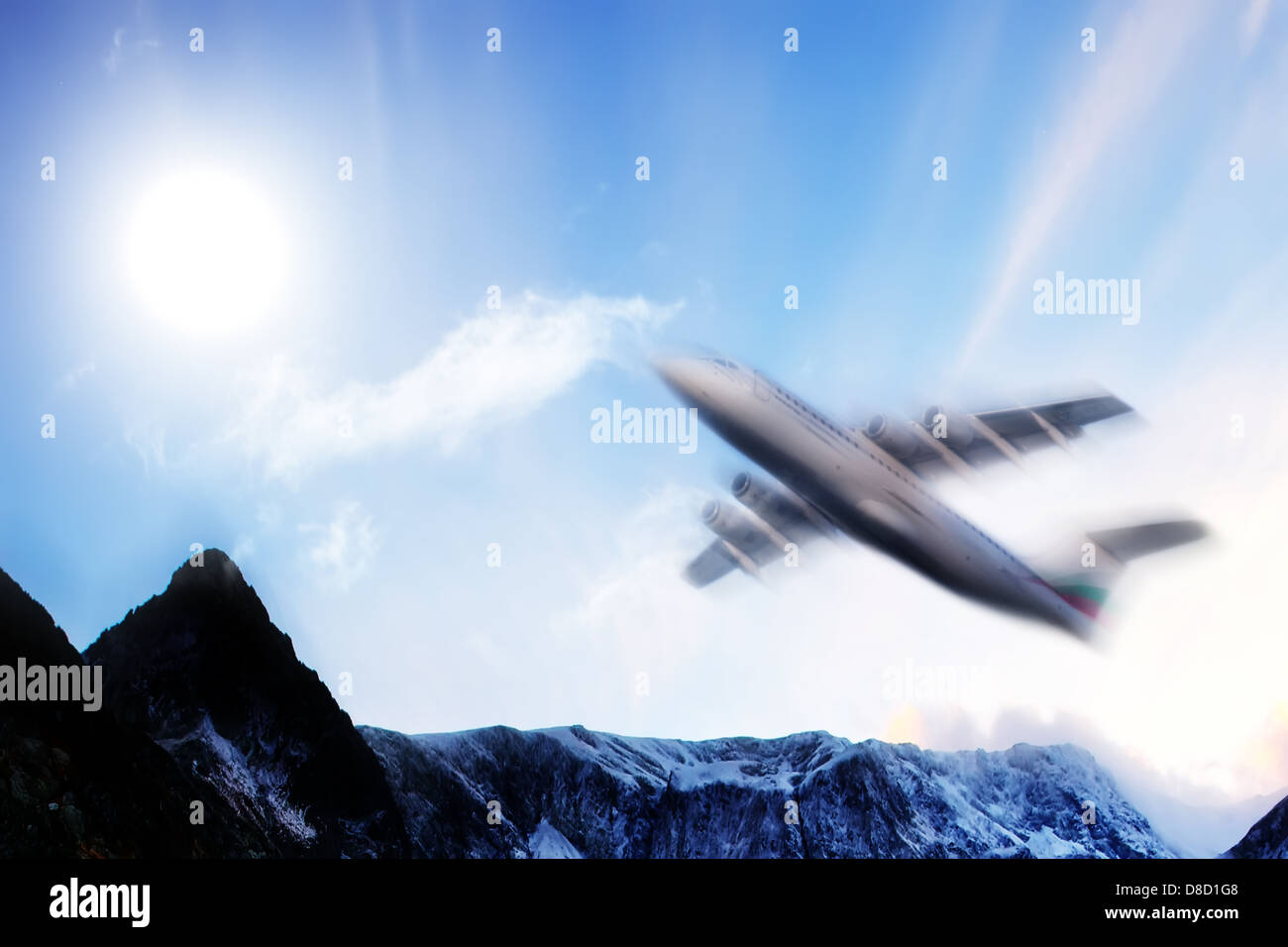 airplane against sun in high mountain Stock Photo - Alamy