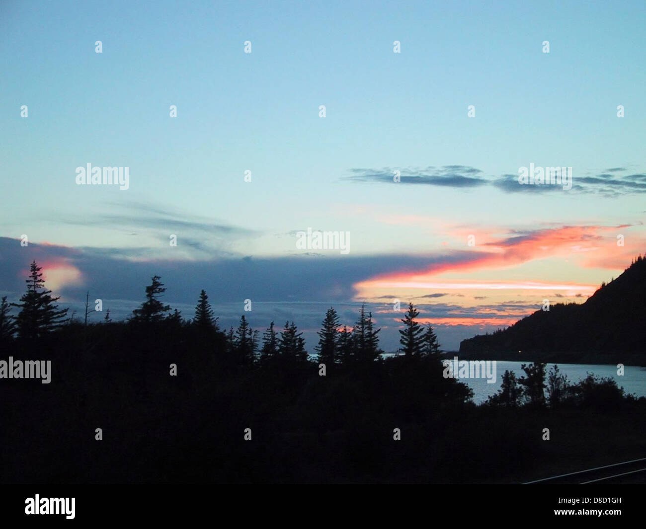 A stunning view of the northern lights during sunset, where vibrant ...