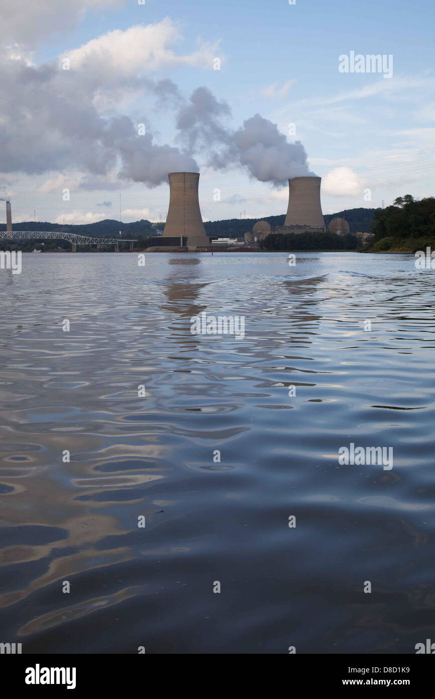 The cooling towers of a nuclear power plant, typically large and ...
