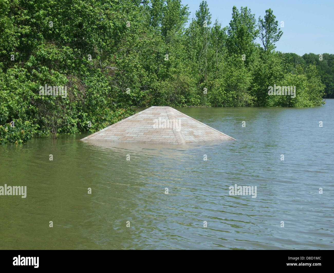 An observation deck is submerged in water, possibly due to heavy ...
