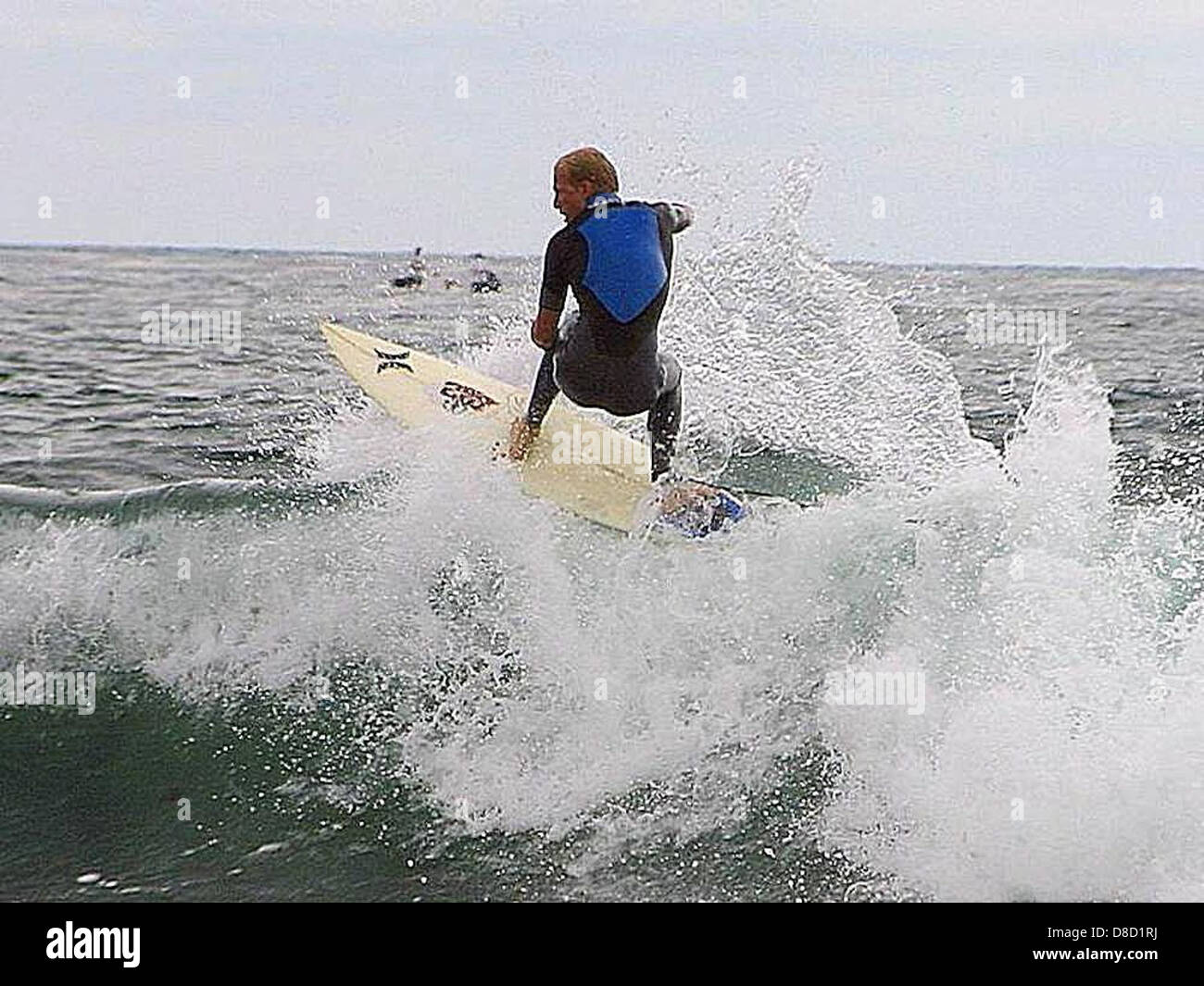 Surfers riding large ocean waves, capturing the thrill of surfing. The ...