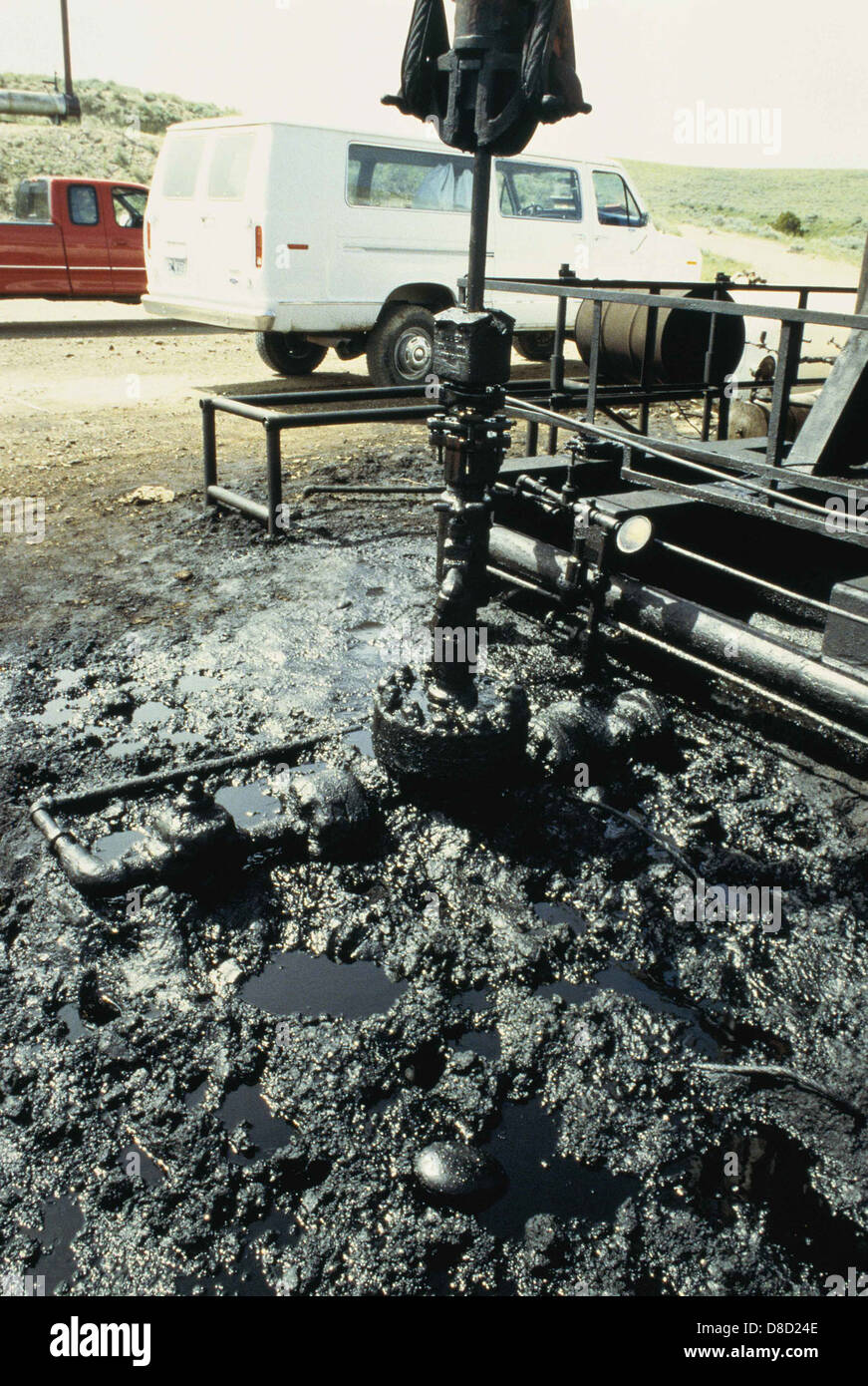 A photo showing the oil well head and the surrounding area impacted by ...