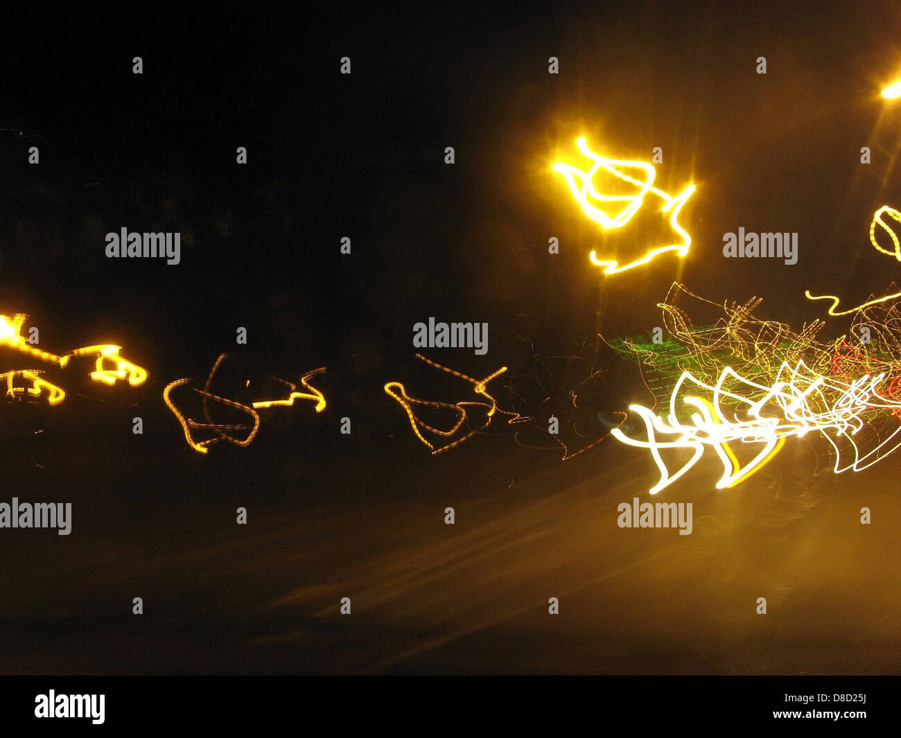 Bright lights create a distortion effect, blurring and warping the ...