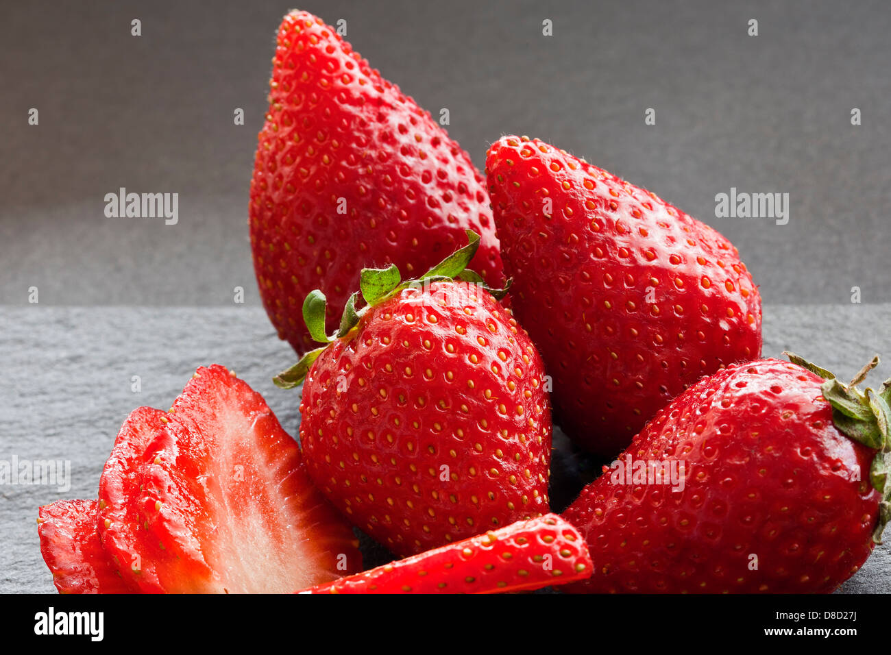 Strawberries set on a gray background Stock Photo - Alamy