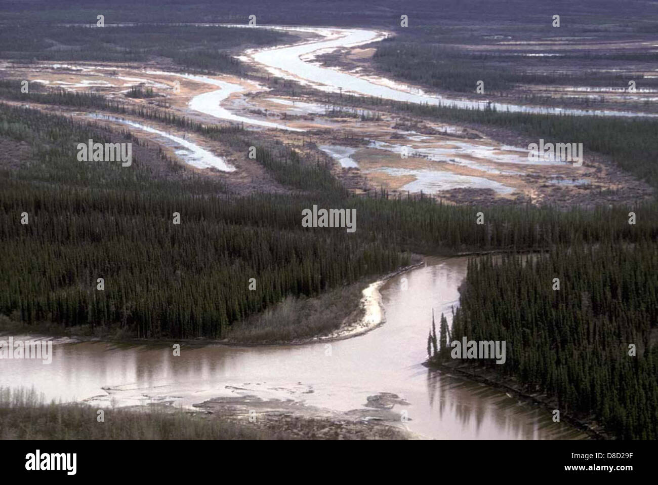 The Lower Sheenjek River is shown winding through a natural landscape ...
