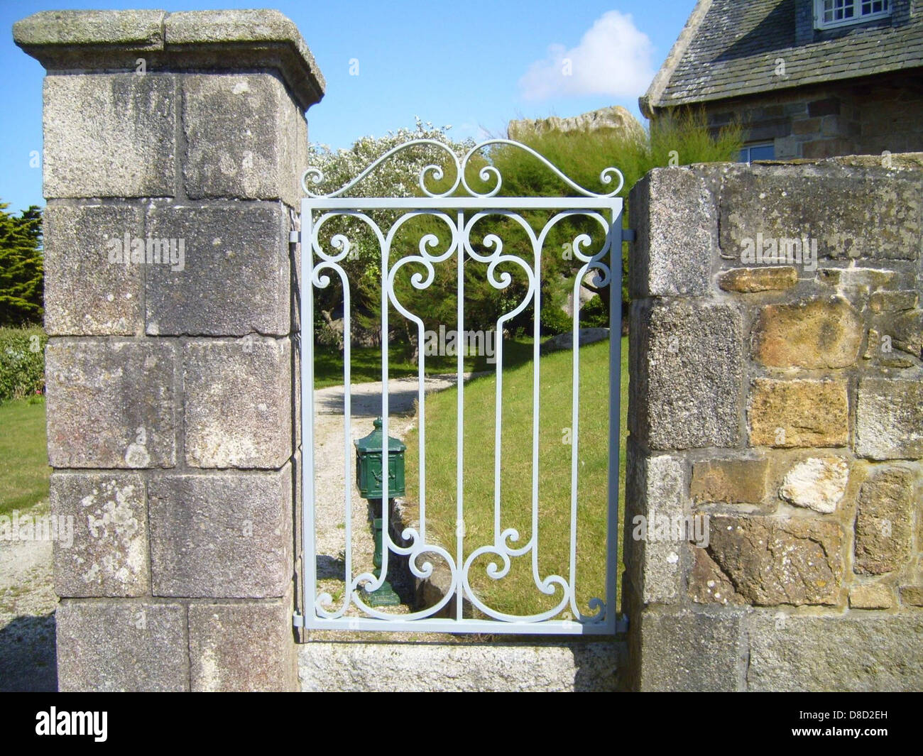 The entrance door features intricate old iron work, showcasing the ...
