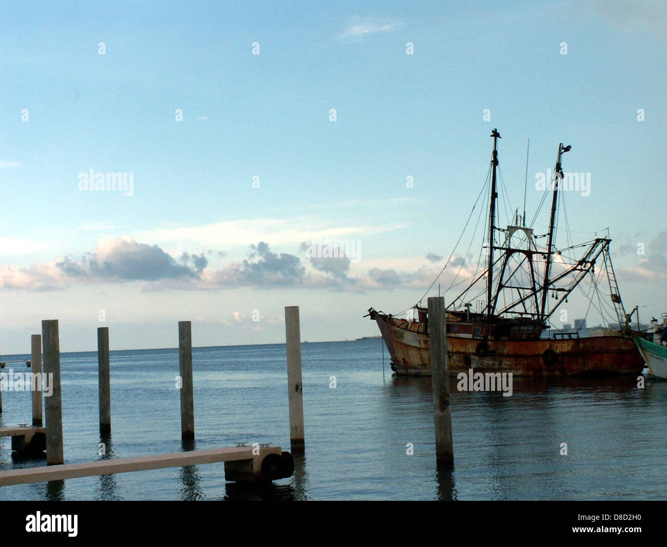 Old rusty fishing boat moored in the harbor Stock Photo - Alamy