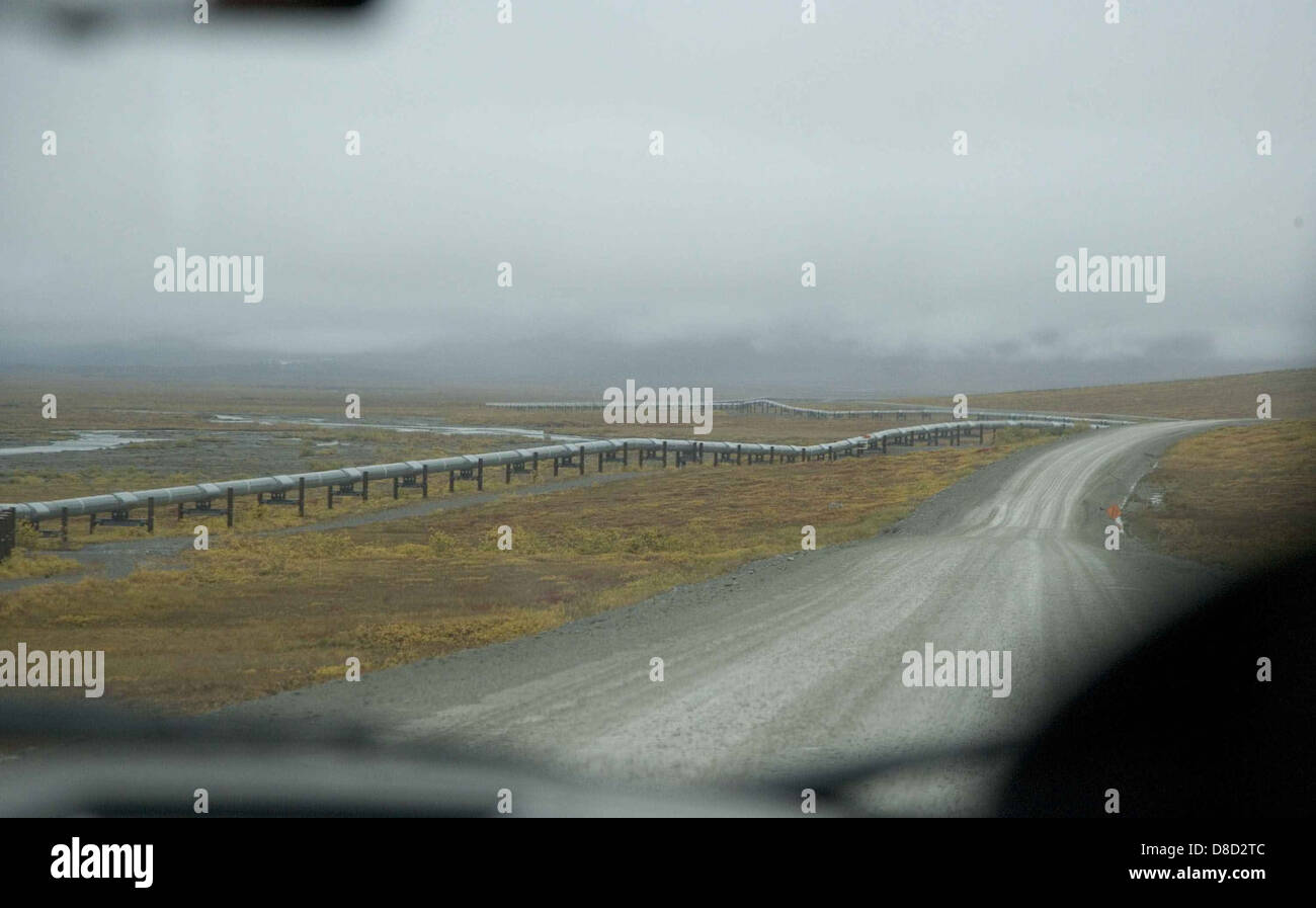 A highway road stretches through the landscape, showing lanes, signs ...