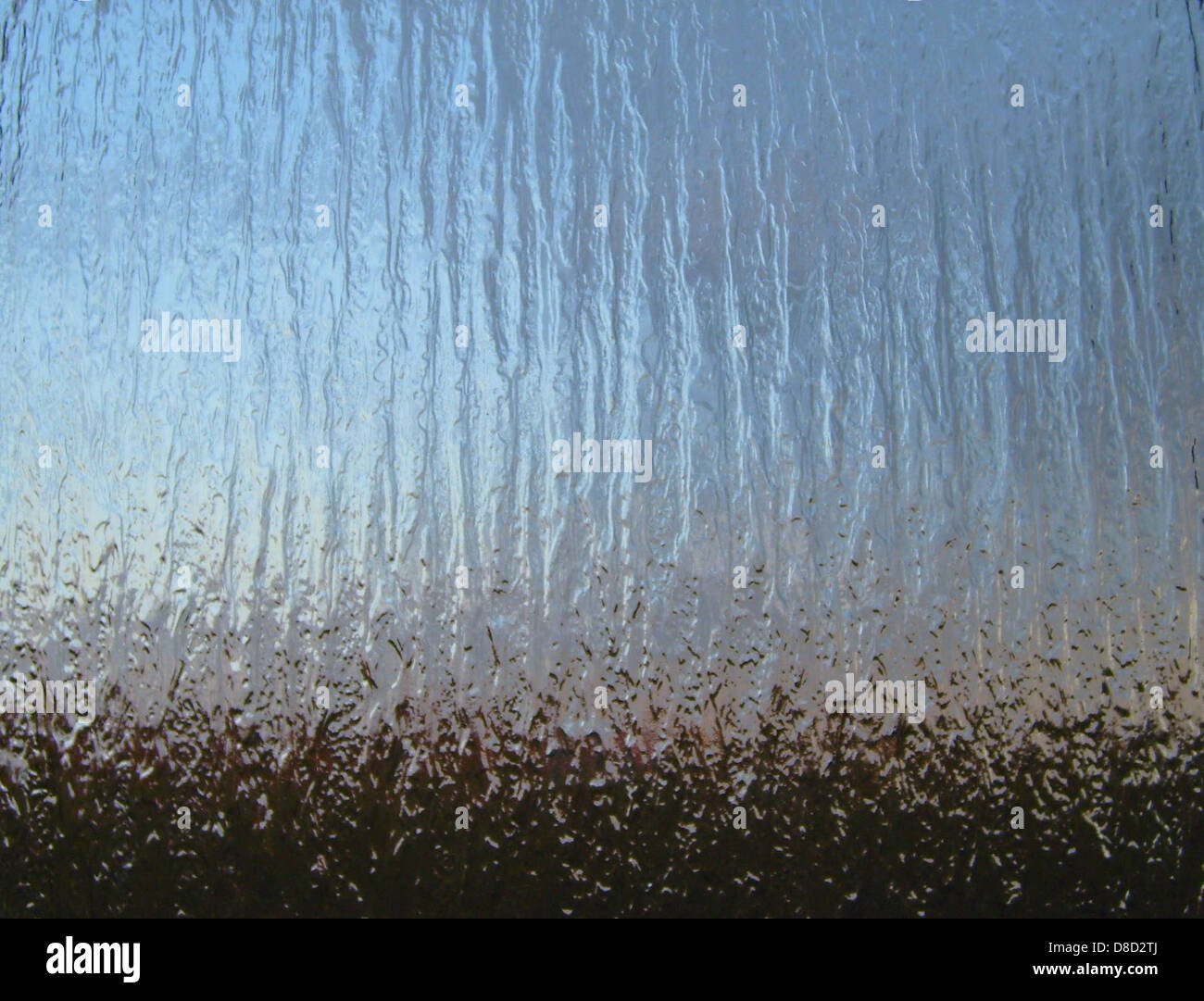 An image of opaque glass, featuring a frosted or cloudy appearance. The ...
