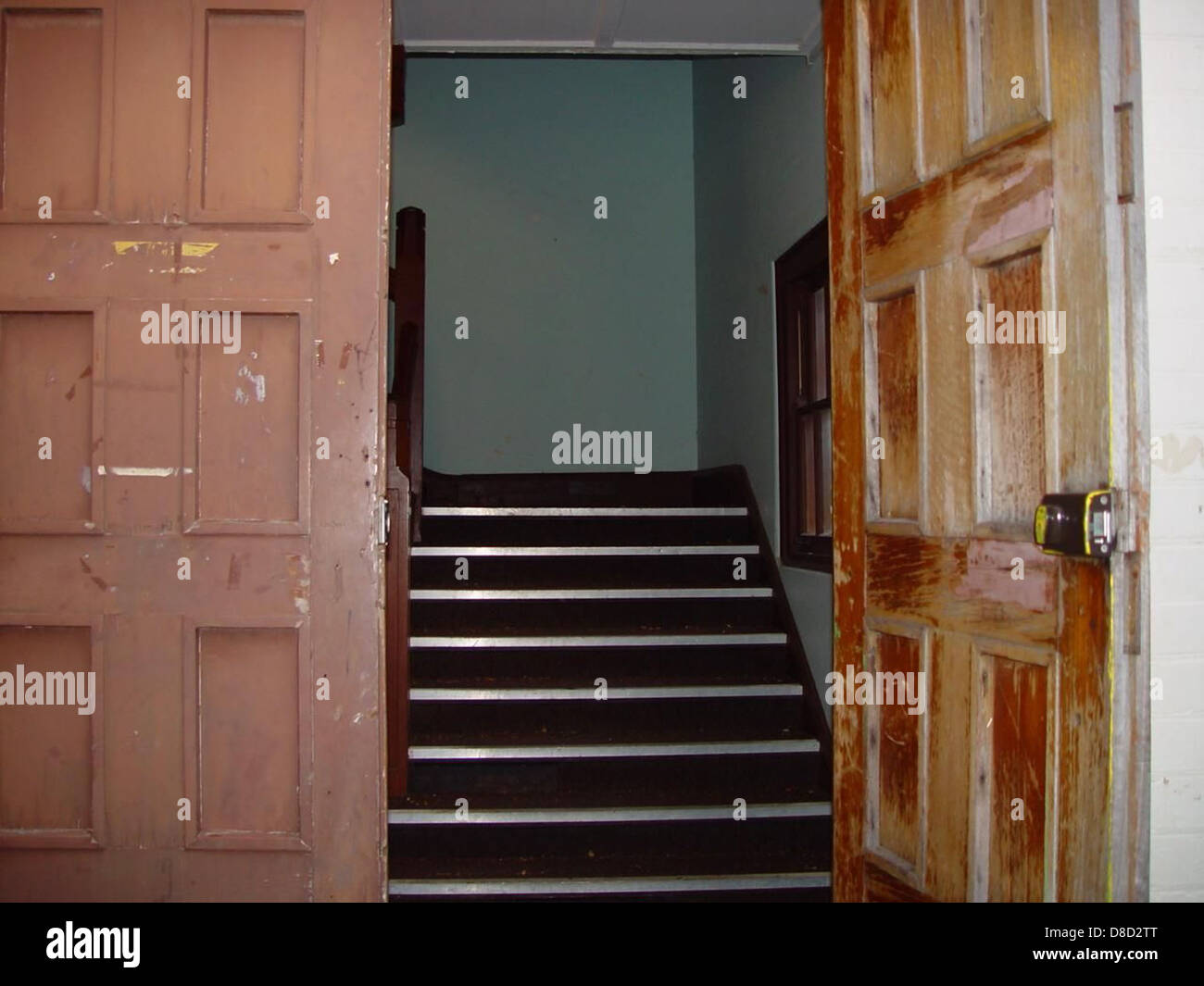 Open door and stairwell Stock Photo - Alamy