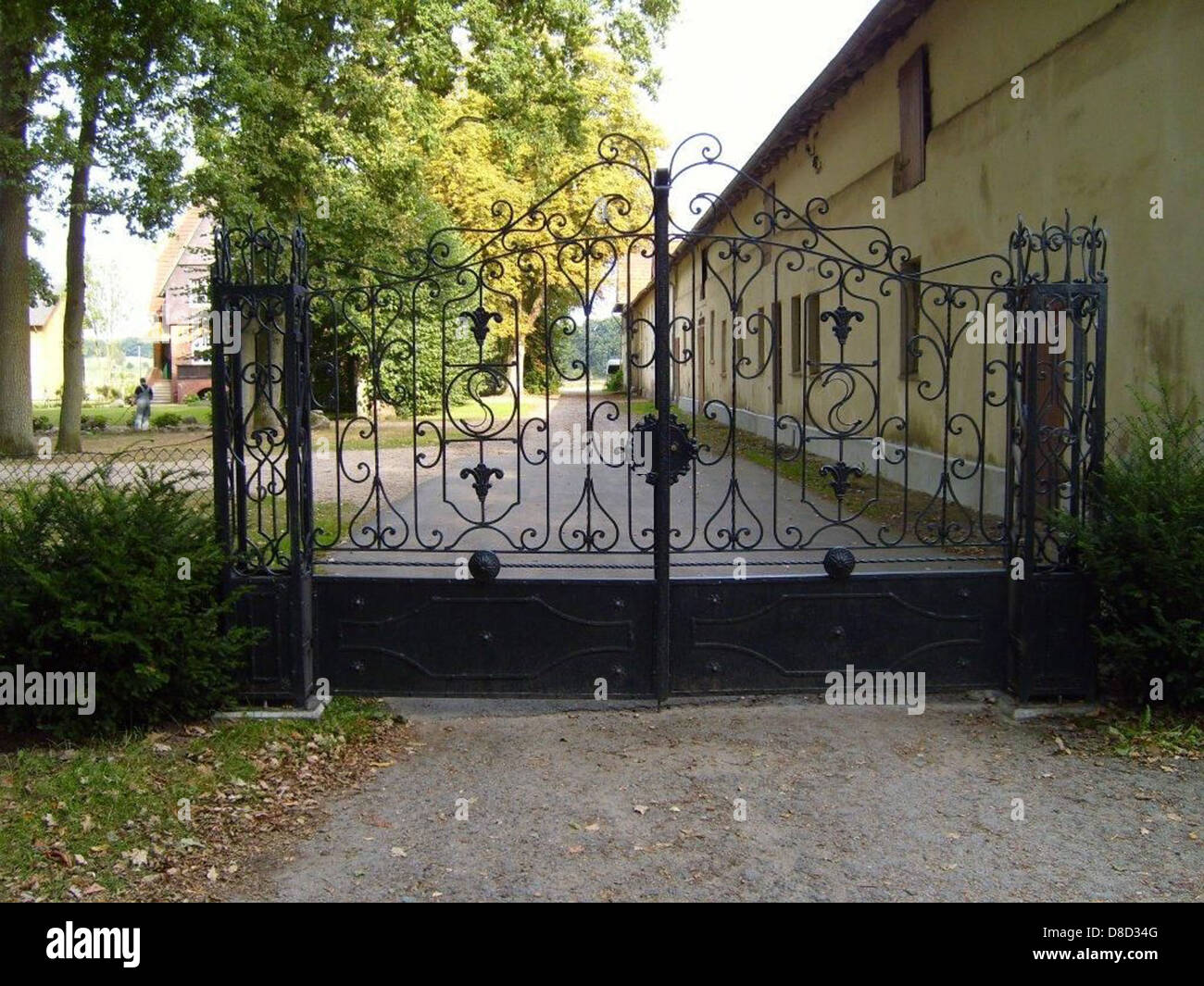 An ornate yard gate, designed with intricate details and decorative ...