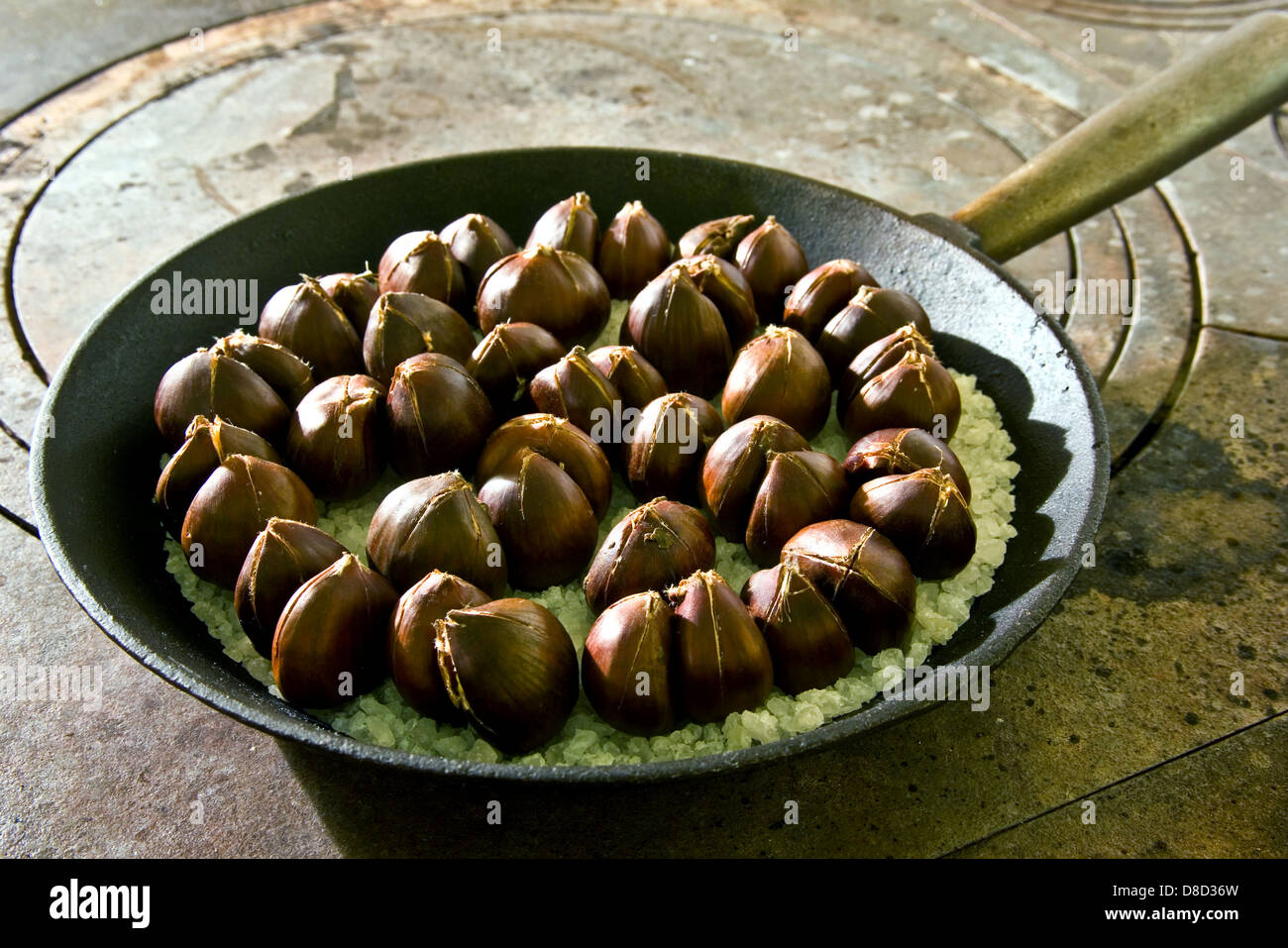 Roasted sweet chestnut on salt Stock Photo - Alamy