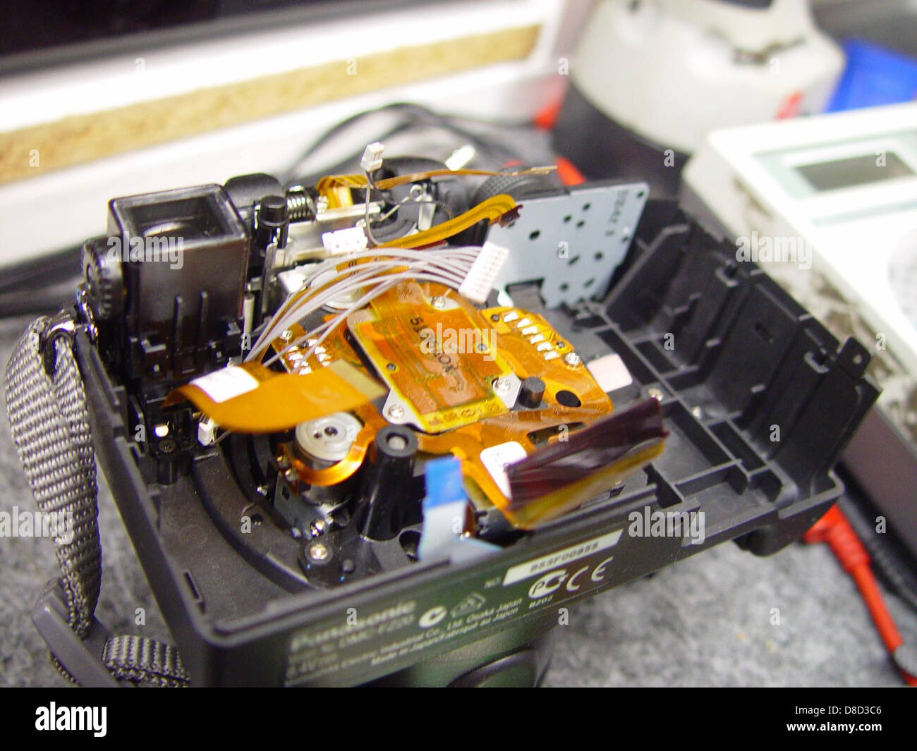 This image shows the internal components of a Panasonic digital camera ...