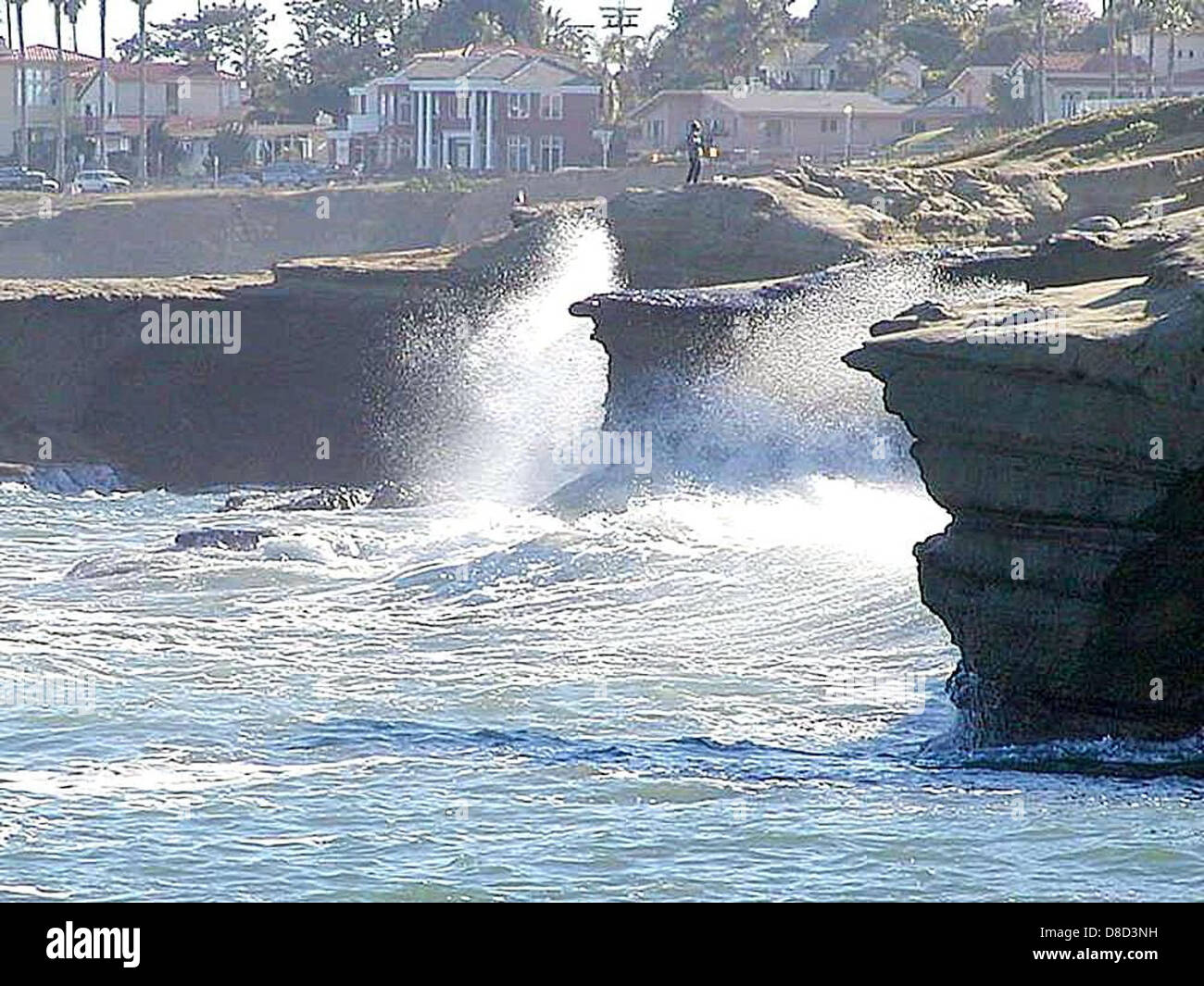 This image captures the serene view of ocean water meeting the sandy ...