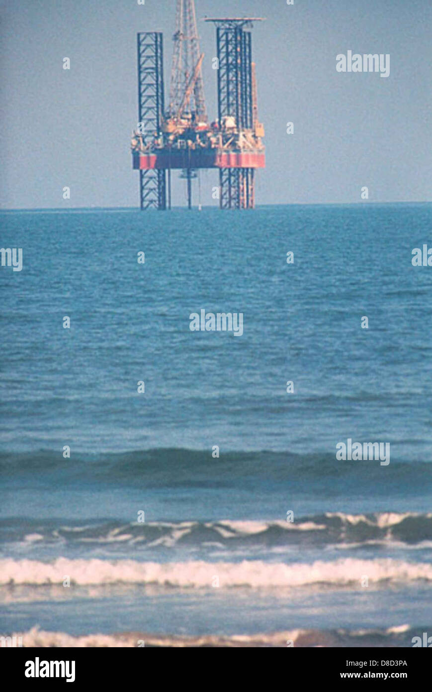 An oil rig is seen on the sea, a structure used for extracting oil from ...