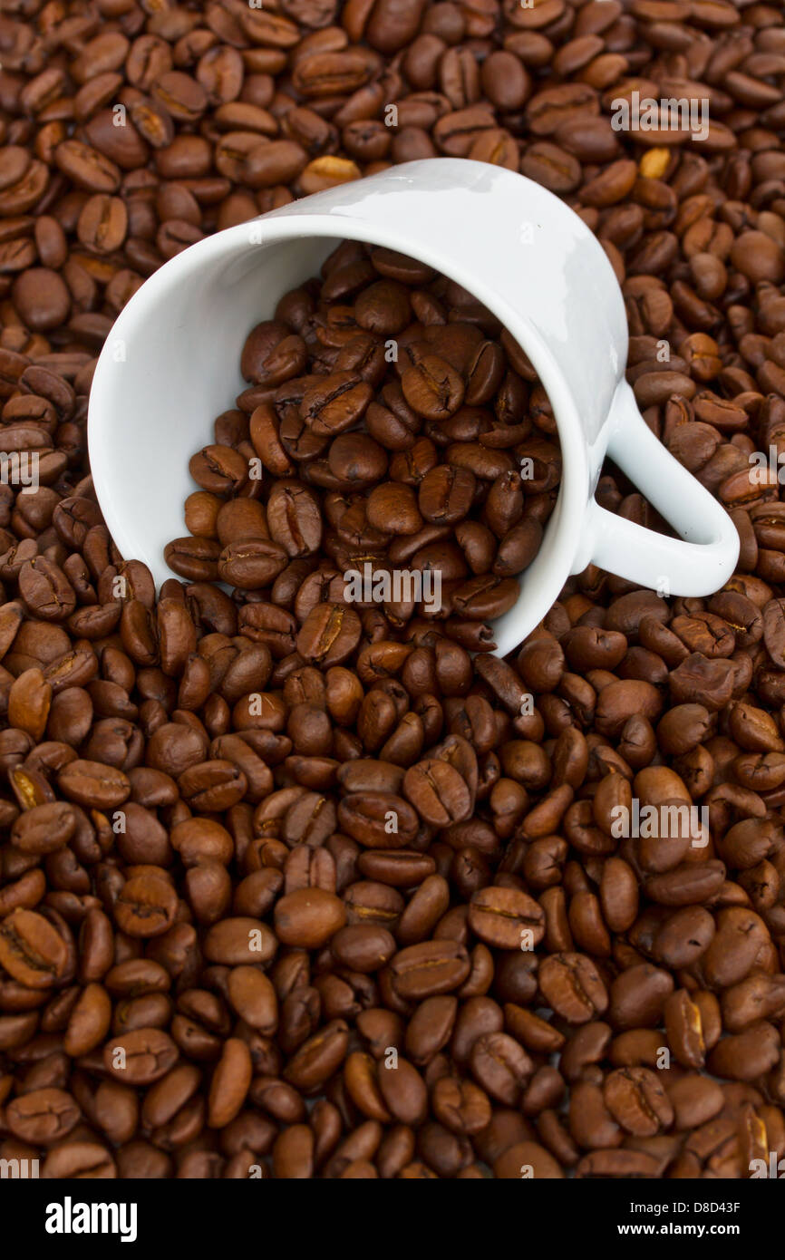 cup with raw coffee beans Stock Photo - Alamy