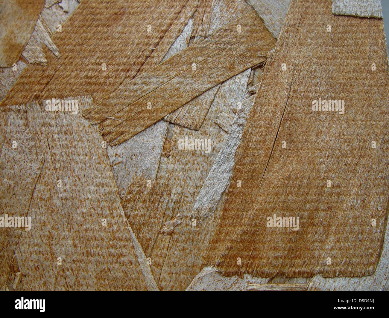 A close-up of the pressed wood texture on a pallet, highlighting the ...