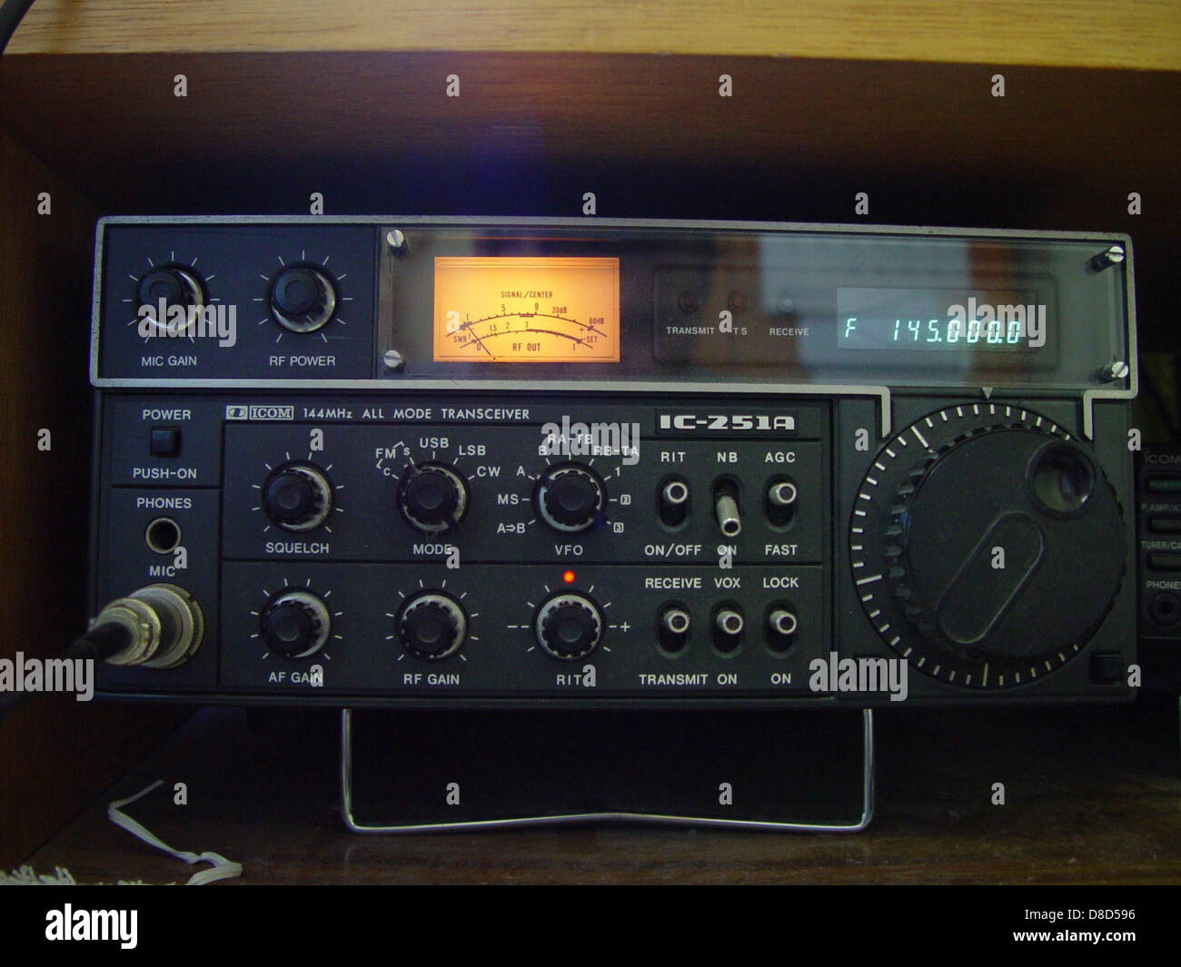 This image features a radio receiver, a device used to receive and ...