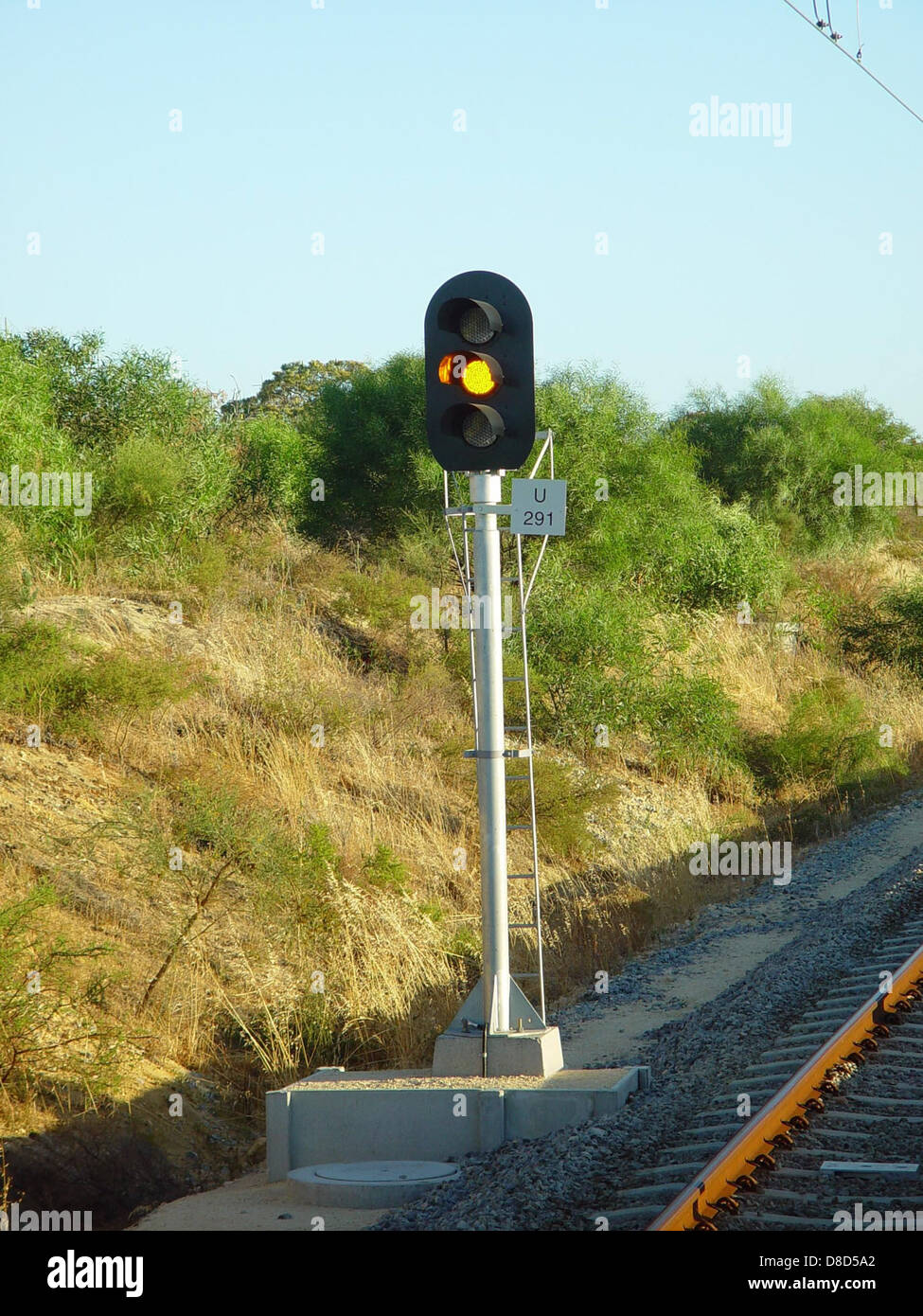 A railway signal in Currambine displays an amber light, signaling ...