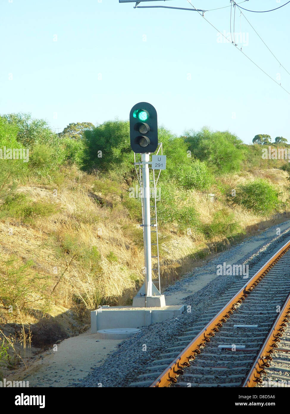 A green railway signal is shown in this image, indicating safe passage ...