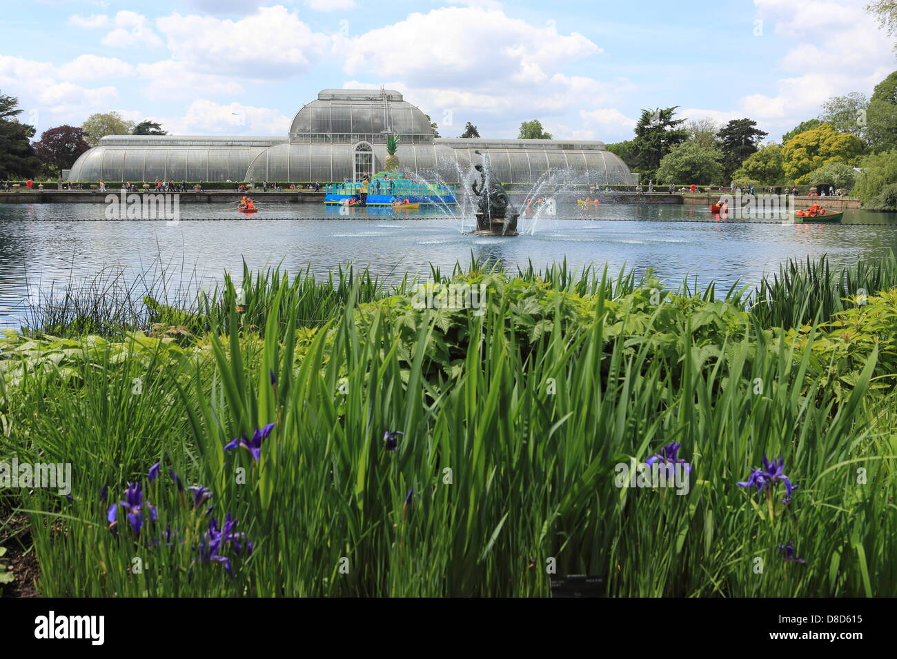 Rowing on the lake in front of the Palm House at Kew Gardens, part of ...