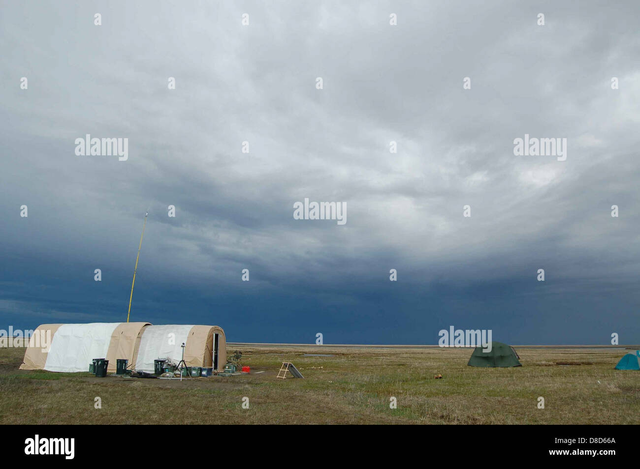 A set of research camping tents is arranged in a remote outdoor ...