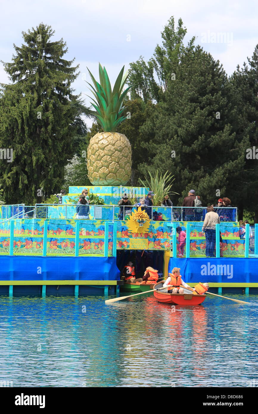 Rowing on the lake in front of the Palm House at Kew Gardens, part of ...