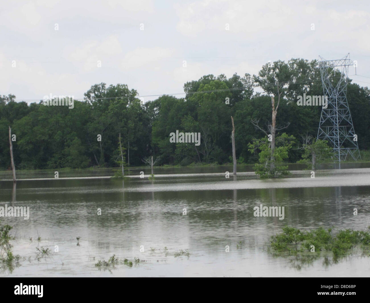 A dramatic image of a river with rising water levels, likely due to ...