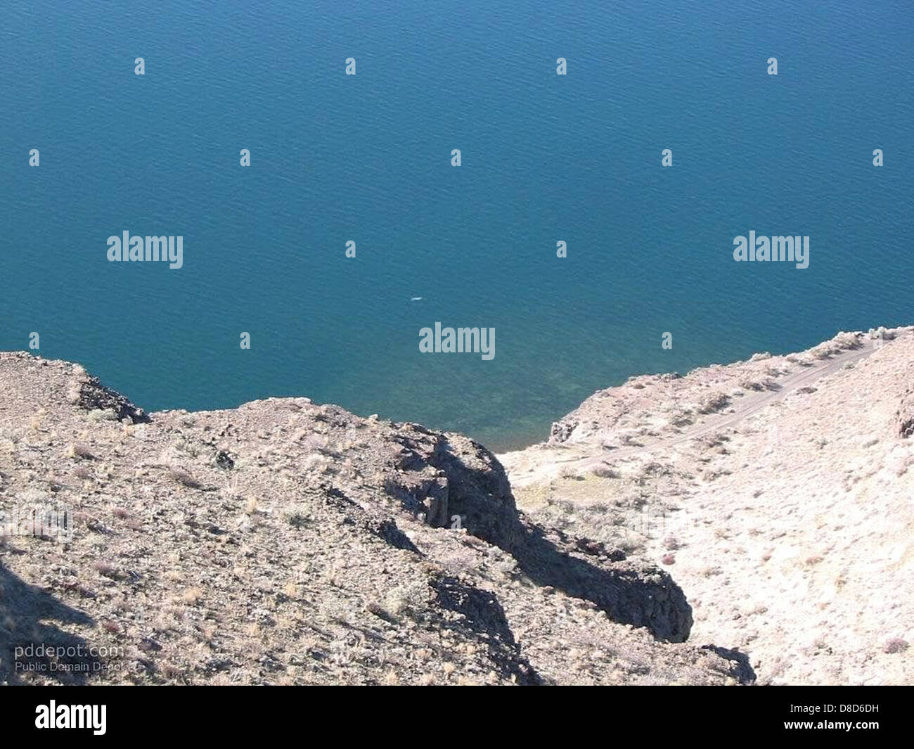 A river flows over and around rocks, creating a natural landscape of ...